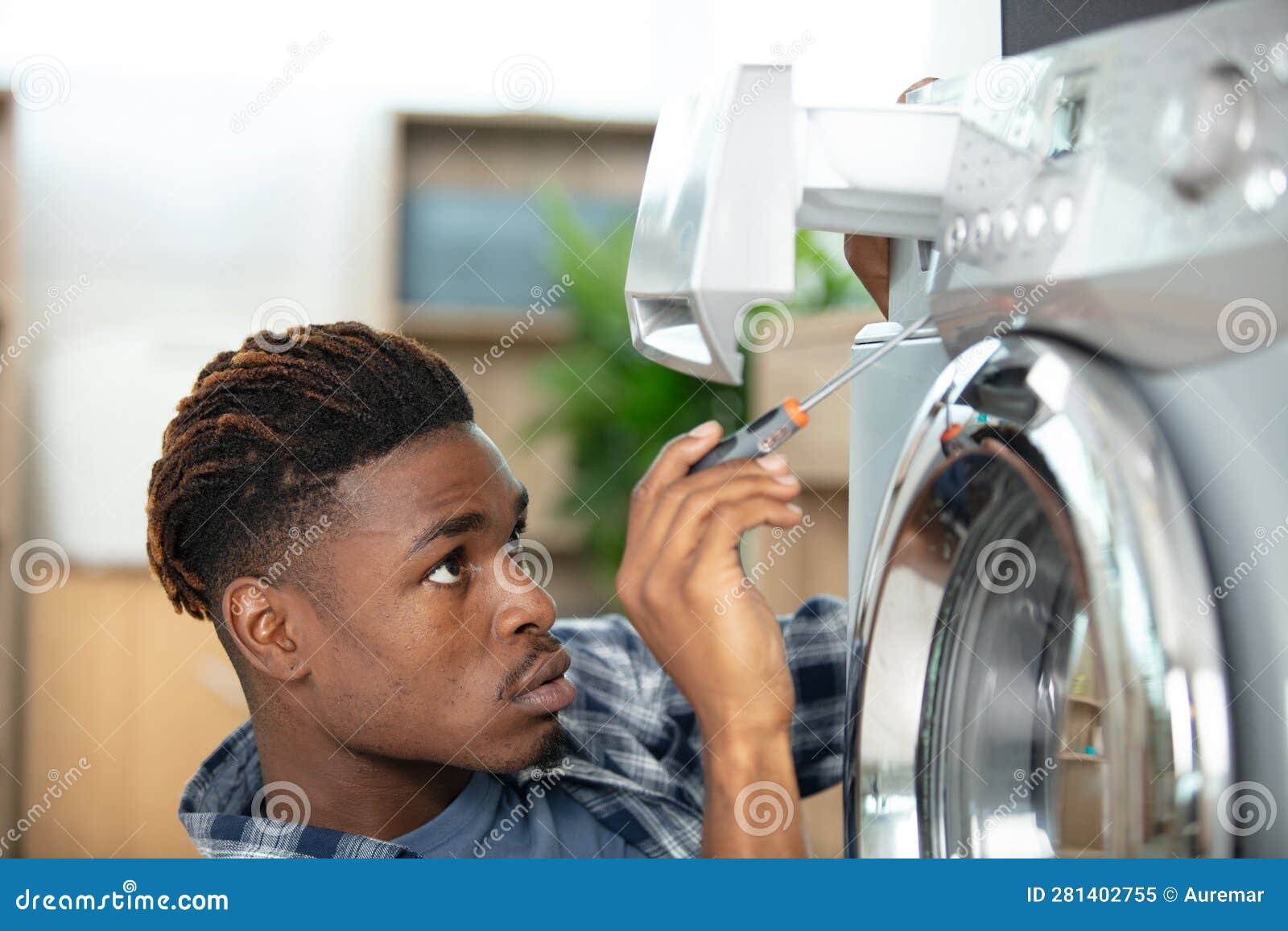 Working Man Plumber Repairs Washing Machine in Laundry Stock Image ...