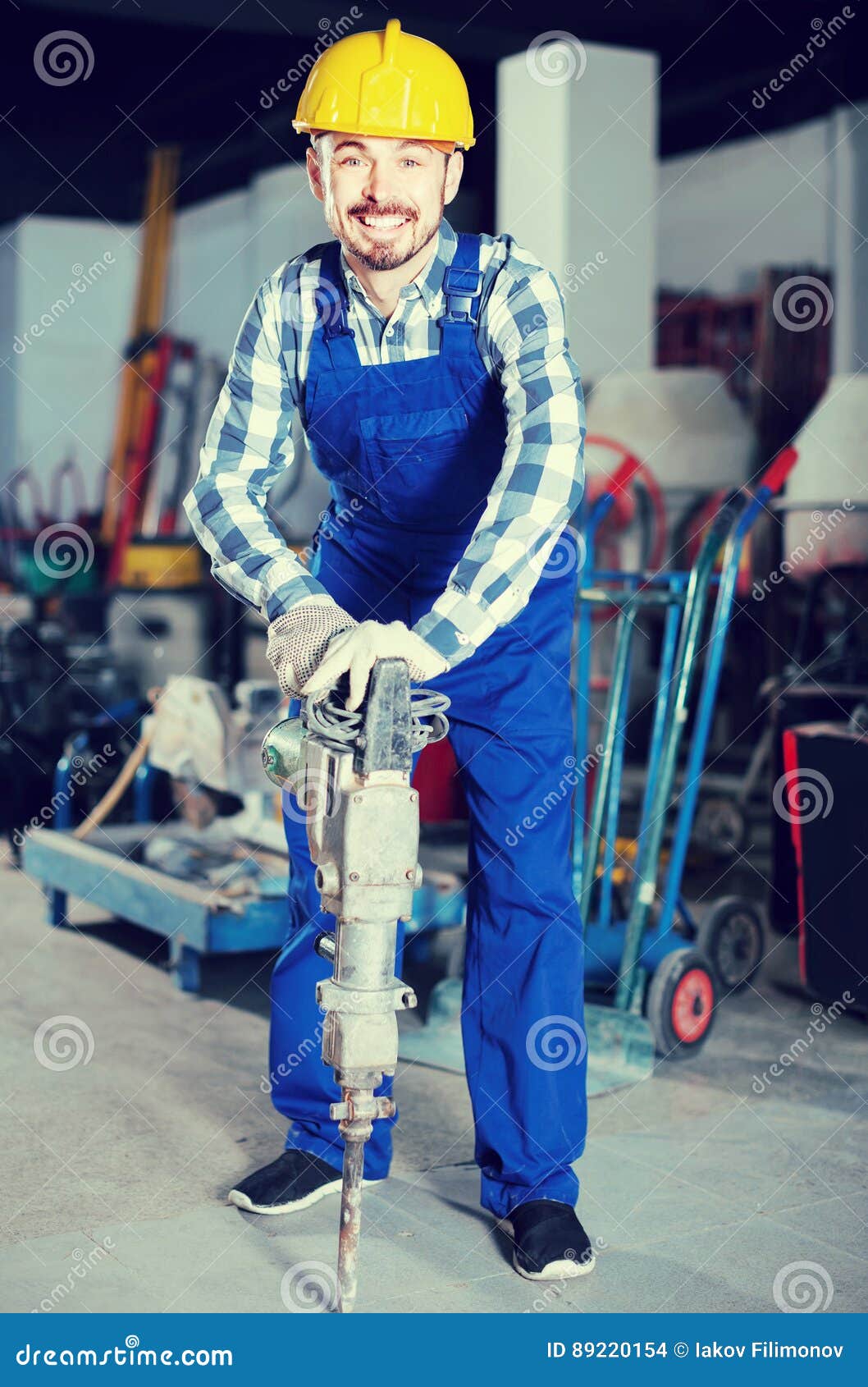 Working Man Practicing His Skills with Pneumatic Drill at Workshop ...