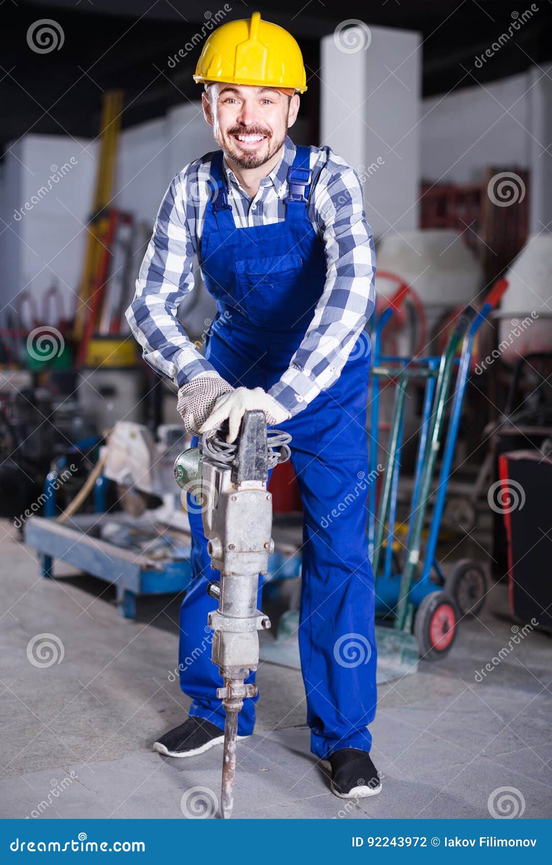 Working Man Practicing His Skills with Pneumatic Drill at Workshop ...