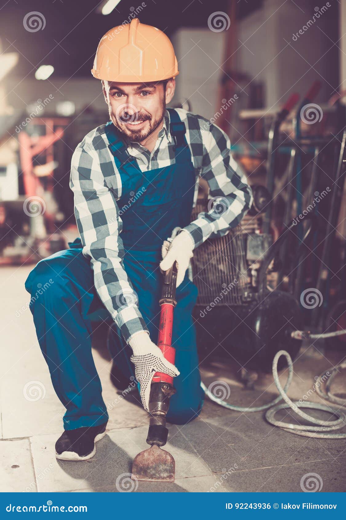 Working Man Practicing His Skills with Pneumatic Drill at Workshop ...