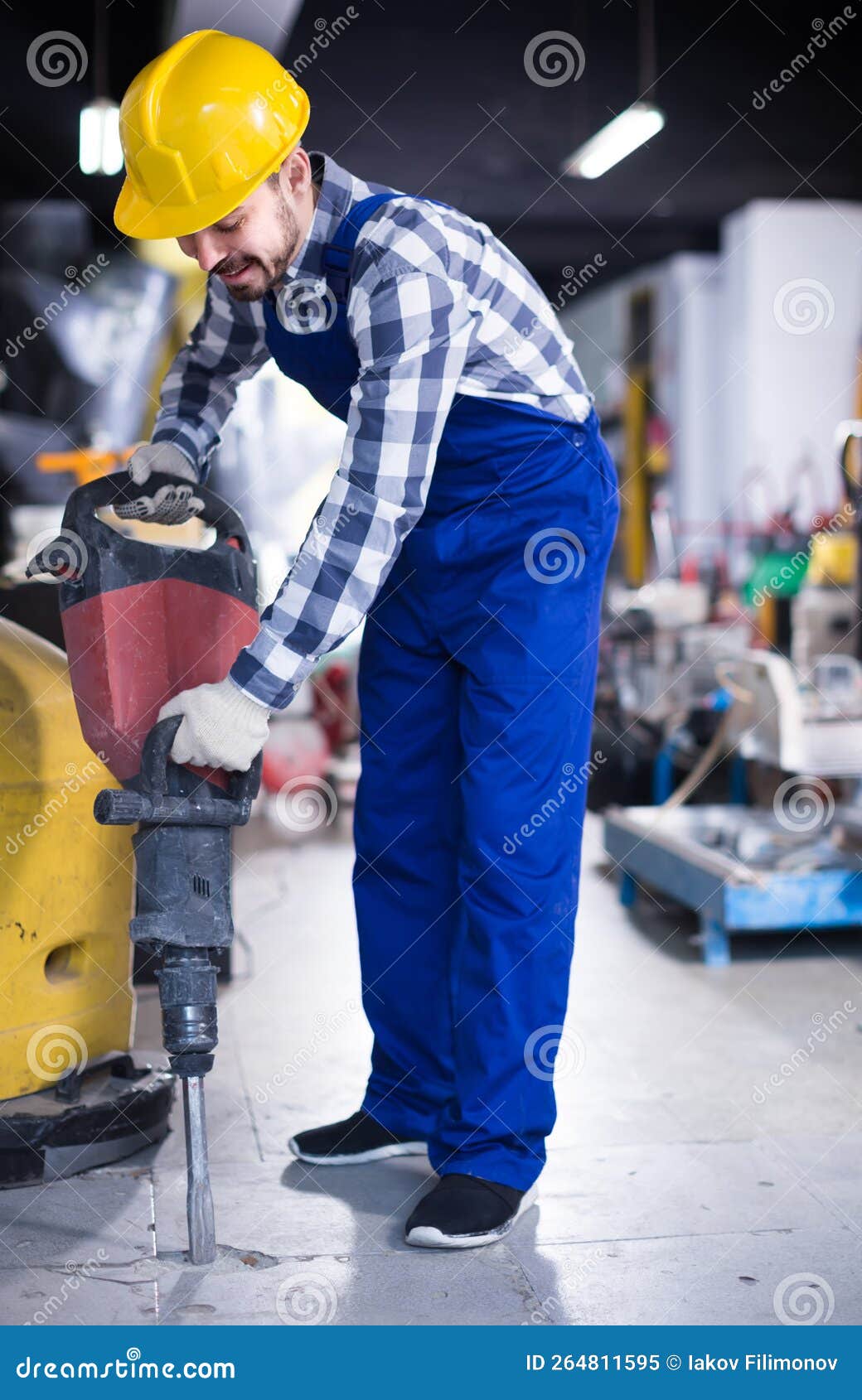 Working Man Practicing His Skills with Pneumatic Drill at Workshop ...