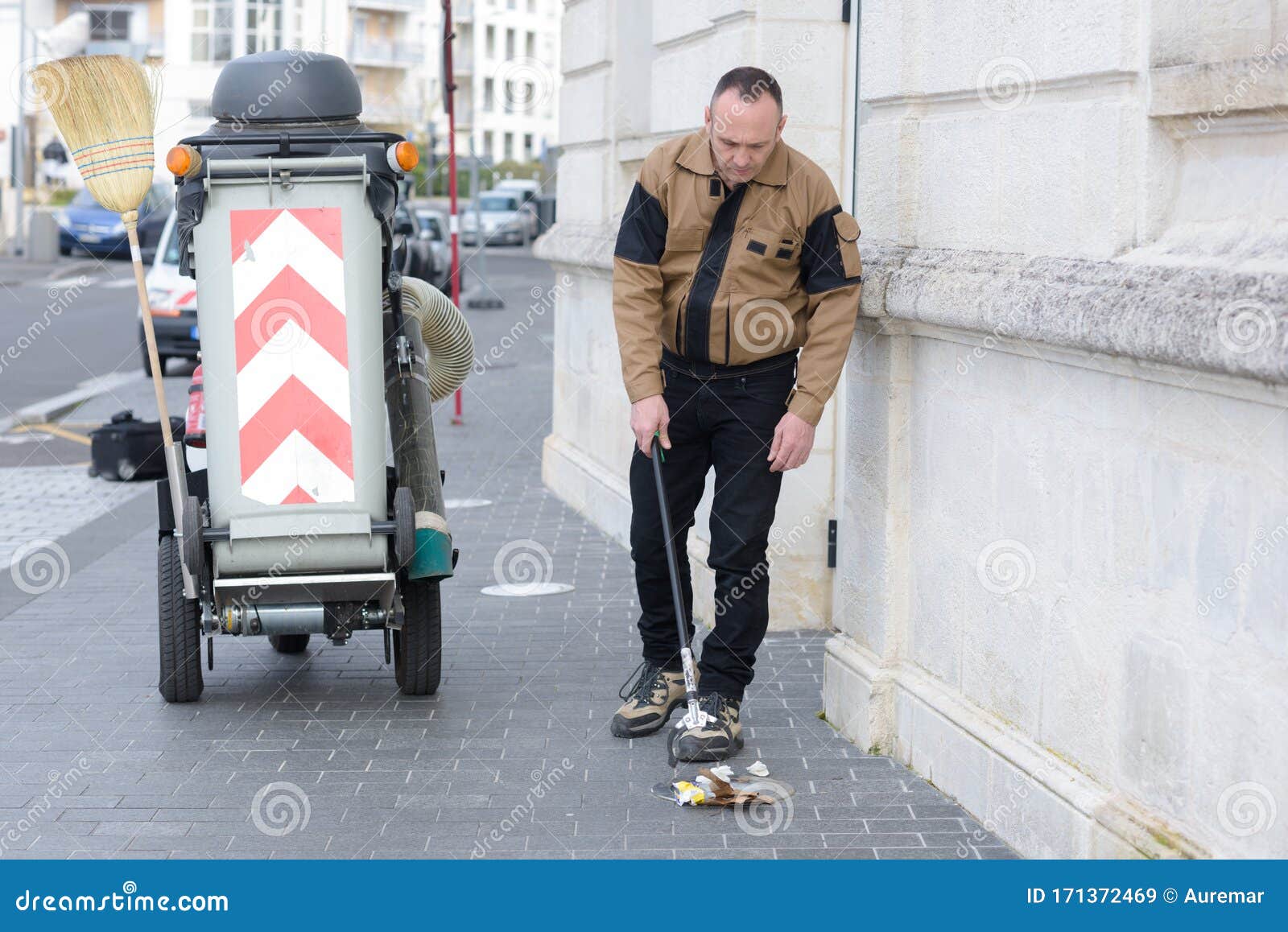 Working Man Standing Near Dustbin on Street Stock Image - Image of tree ...