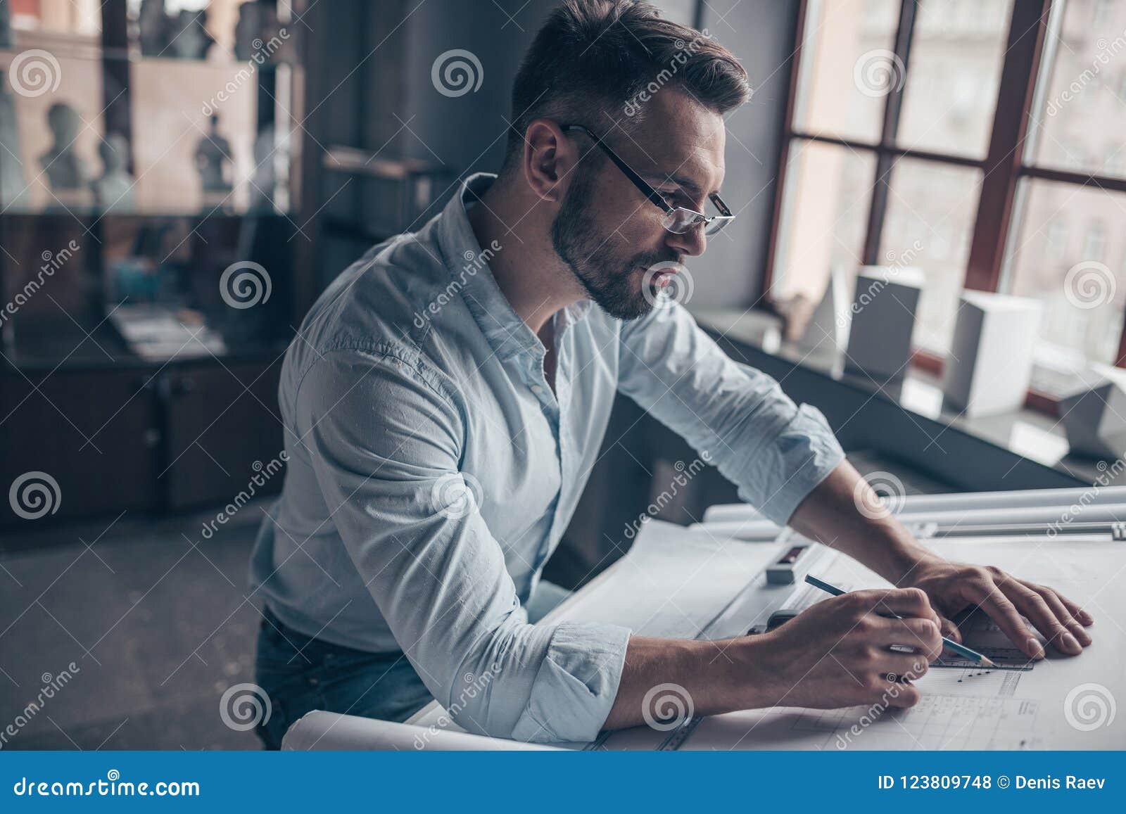 Working man in the studio stock photo. Image of interior - 123809748