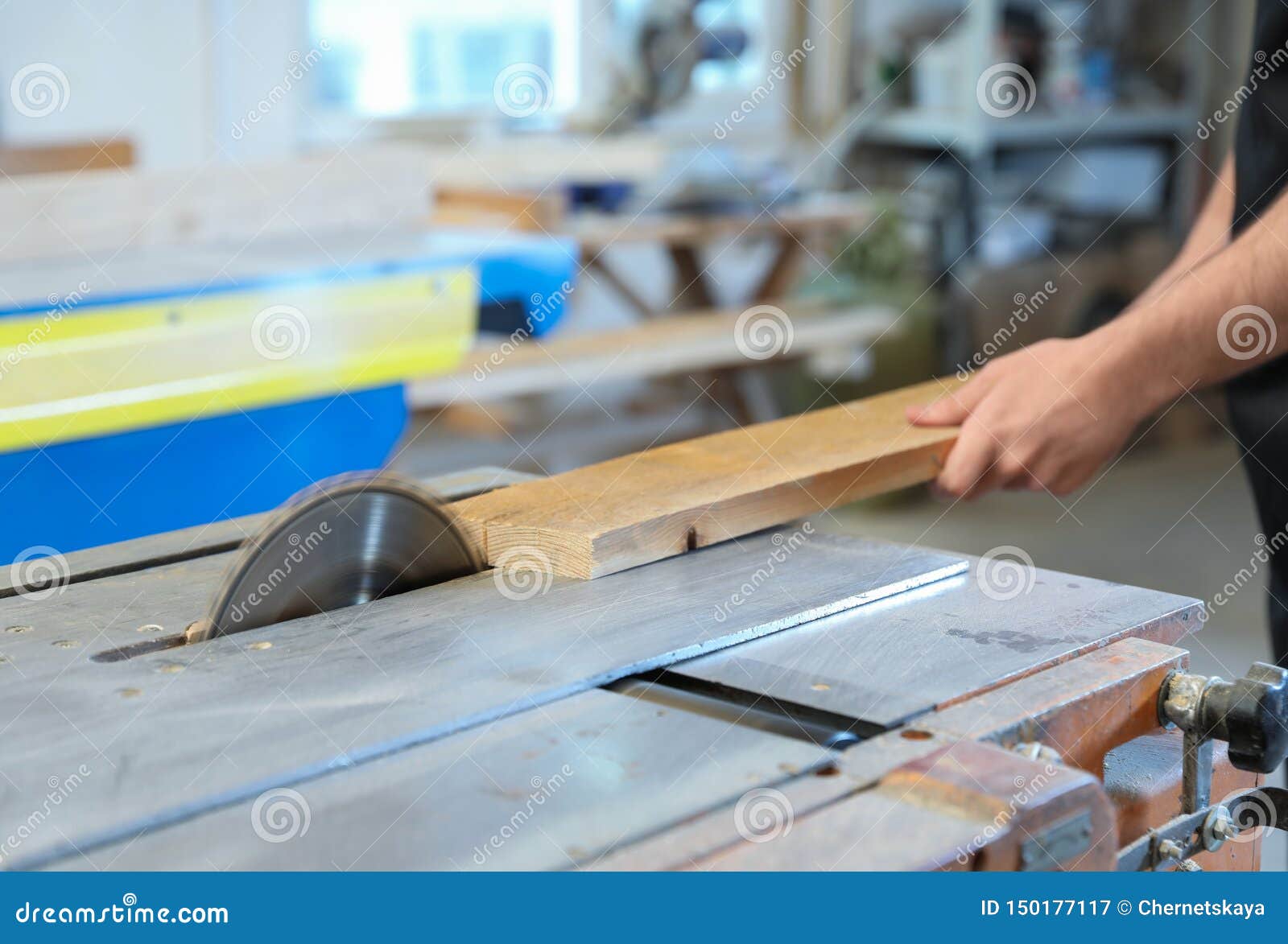 Working Man Using Circular Saw at Carpentry Shop Stock Image - Image of ...