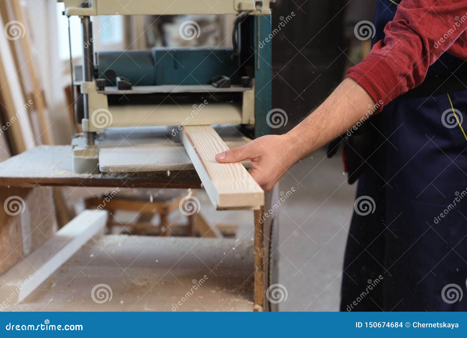 Working Man Using Thickness Planer at Carpentry Shop Stock Photo ...