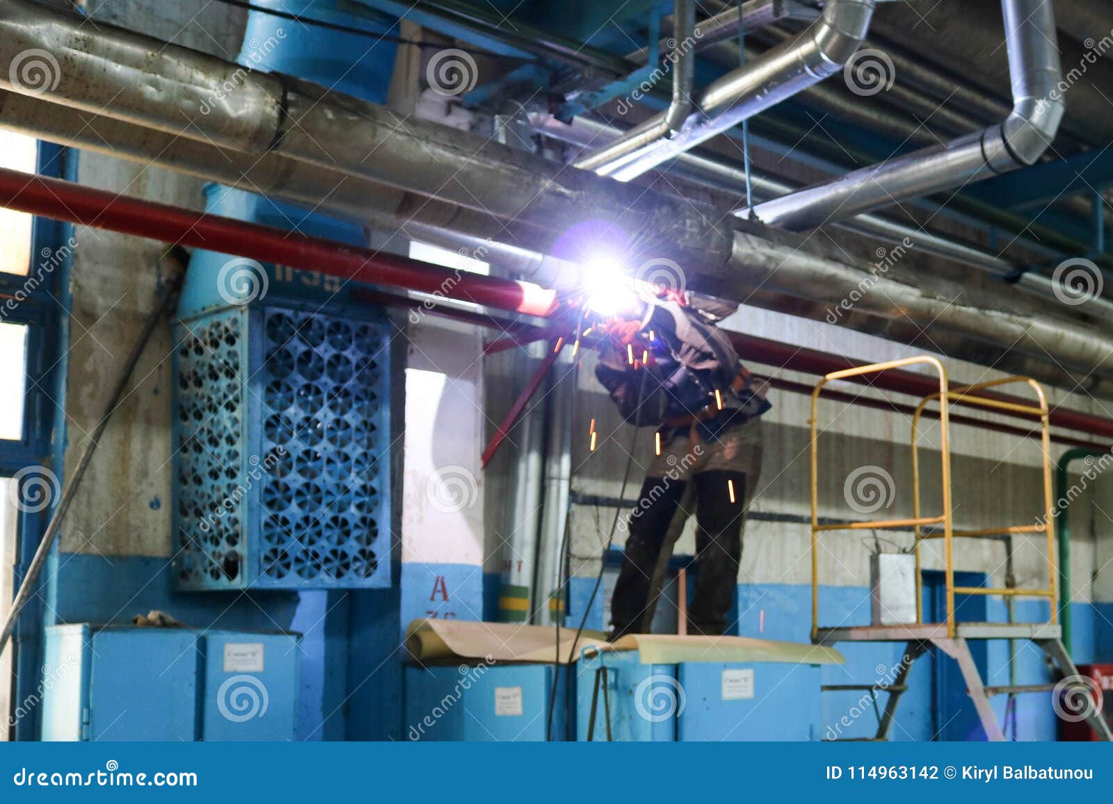A Welder Welds Technological Pipelines With Manual Arc Welding For An ...