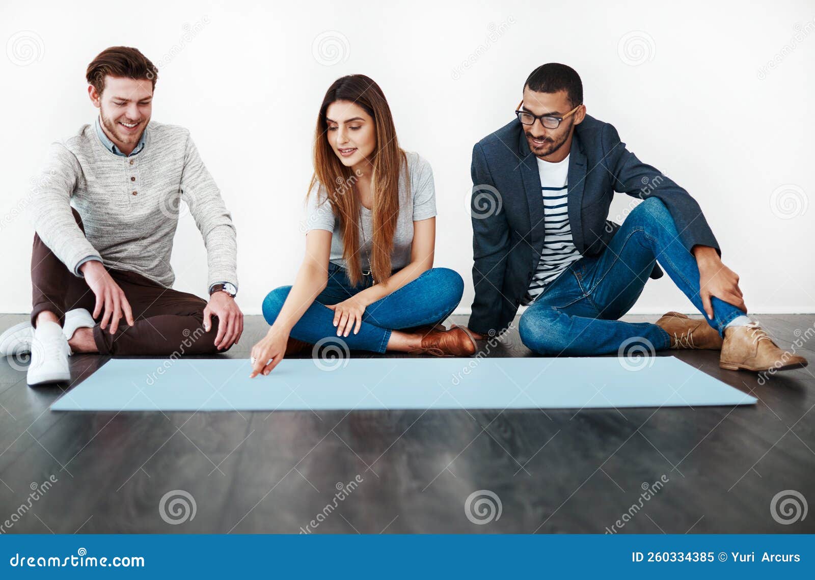 Working on a Master Plan. Studio Shot of a Group of Young People ...