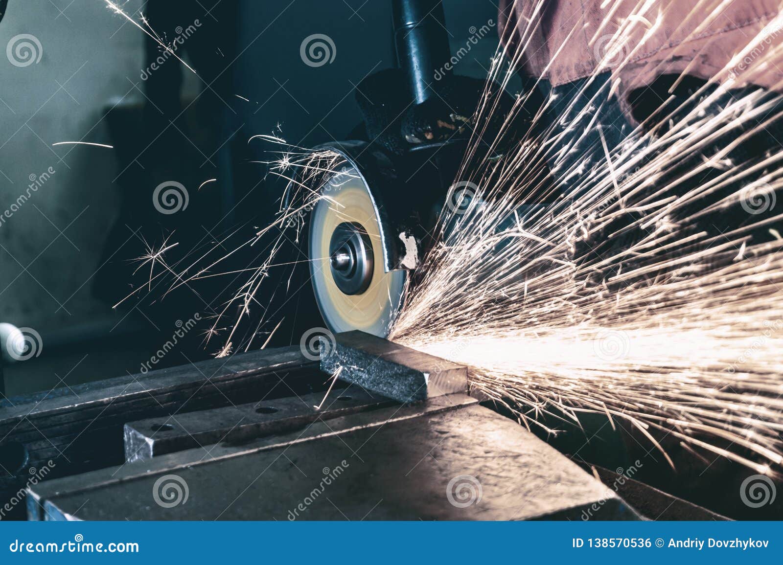 The Working Mechanic Cleans the Metal by Grinding Stock Photo - Image ...