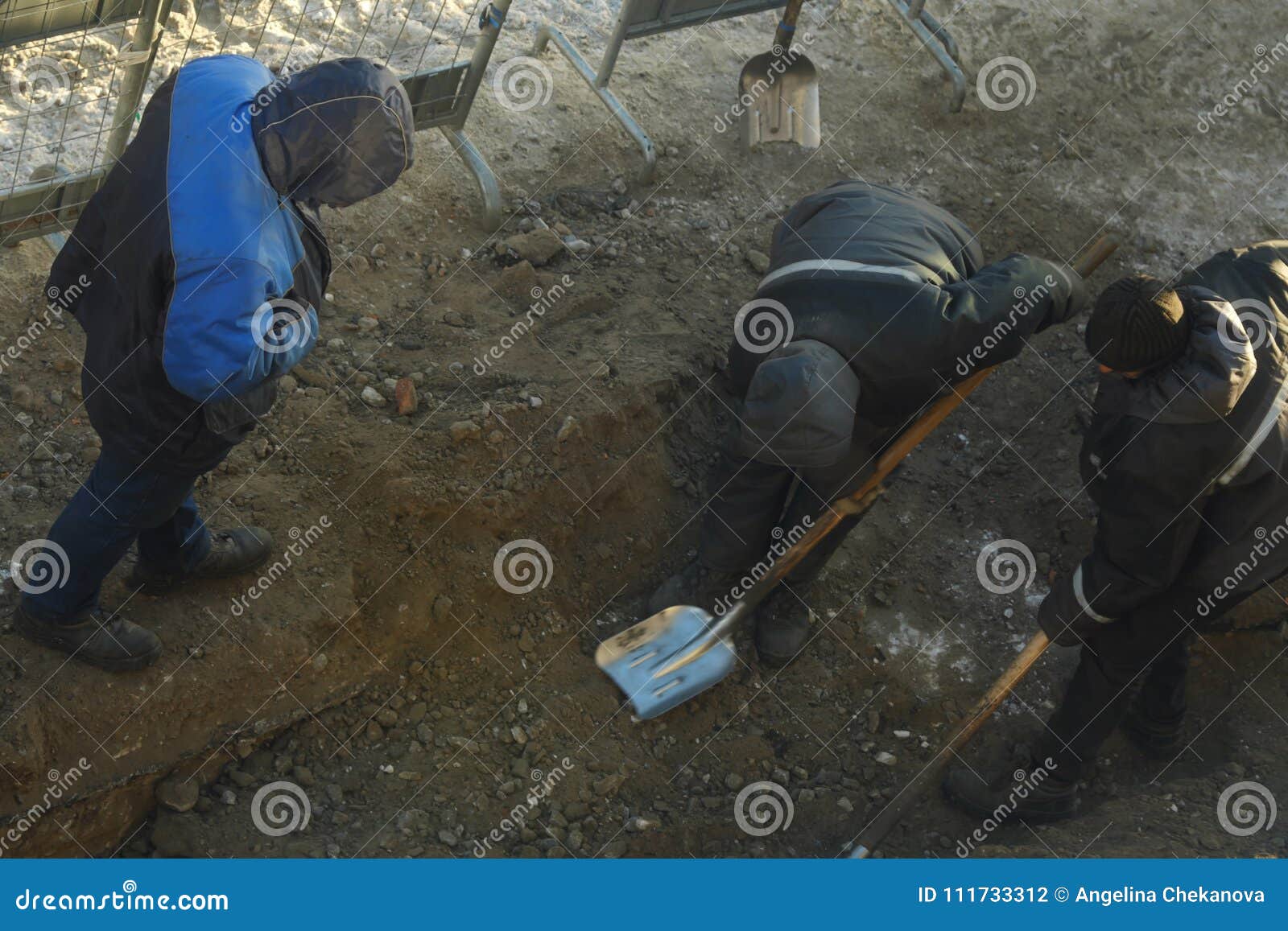 Working Men in the Form of Standing Around a Sand Pit Editorial ...