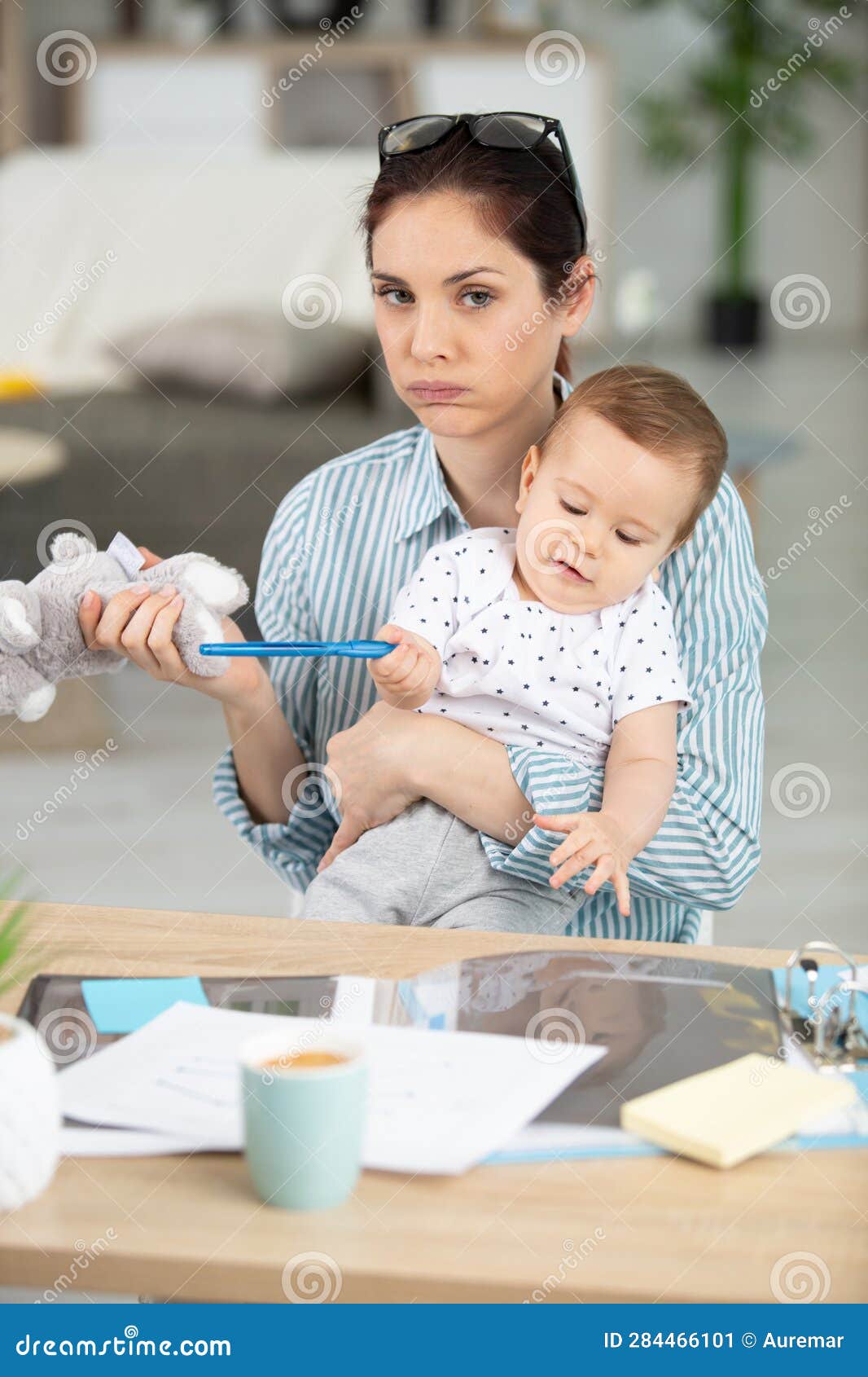 Working Mum Finding it Difficult with Baby on Lap Stock Image - Image ...