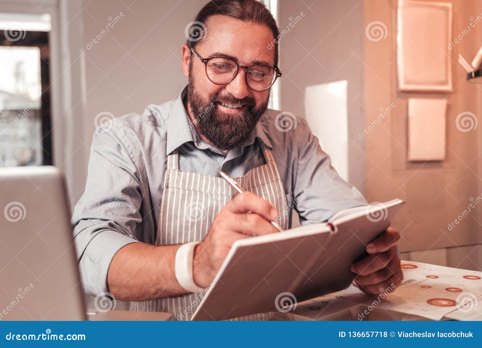 Waiter Making Important Notes in His Notebook Stock Photo - Image of ...