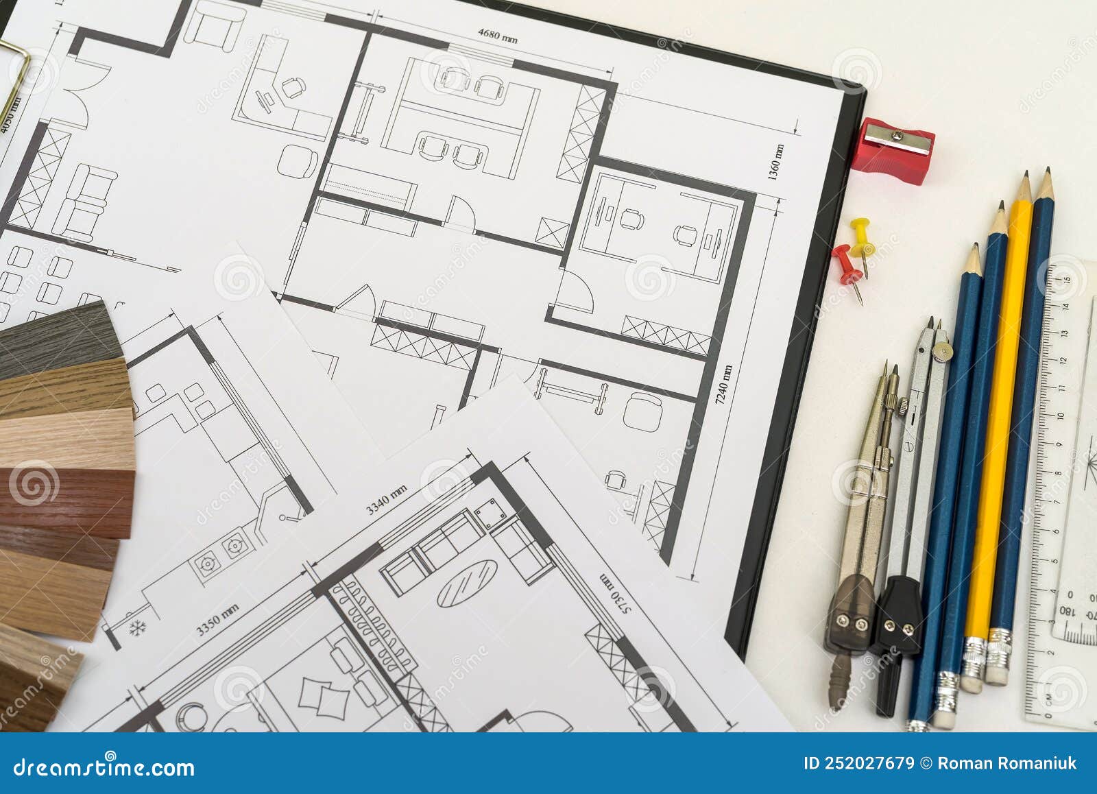 Working at Office Desk with House Blueprints for New Project and Color ...