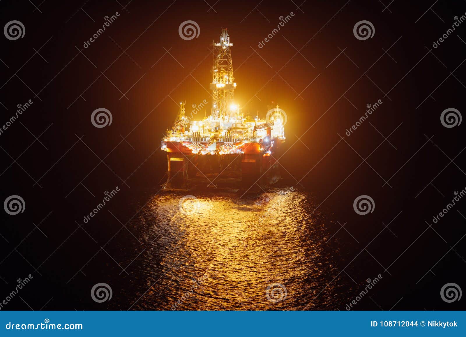 Offshore Oil Platform at Night Stock Photo - Image of light, platform ...
