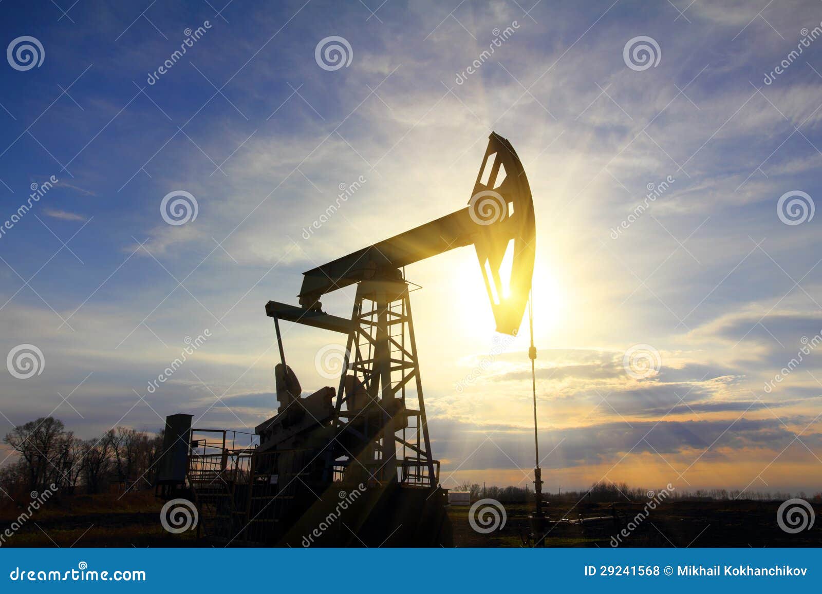Working oil pump at sunset stock photo. Image of silhouette - 29241568