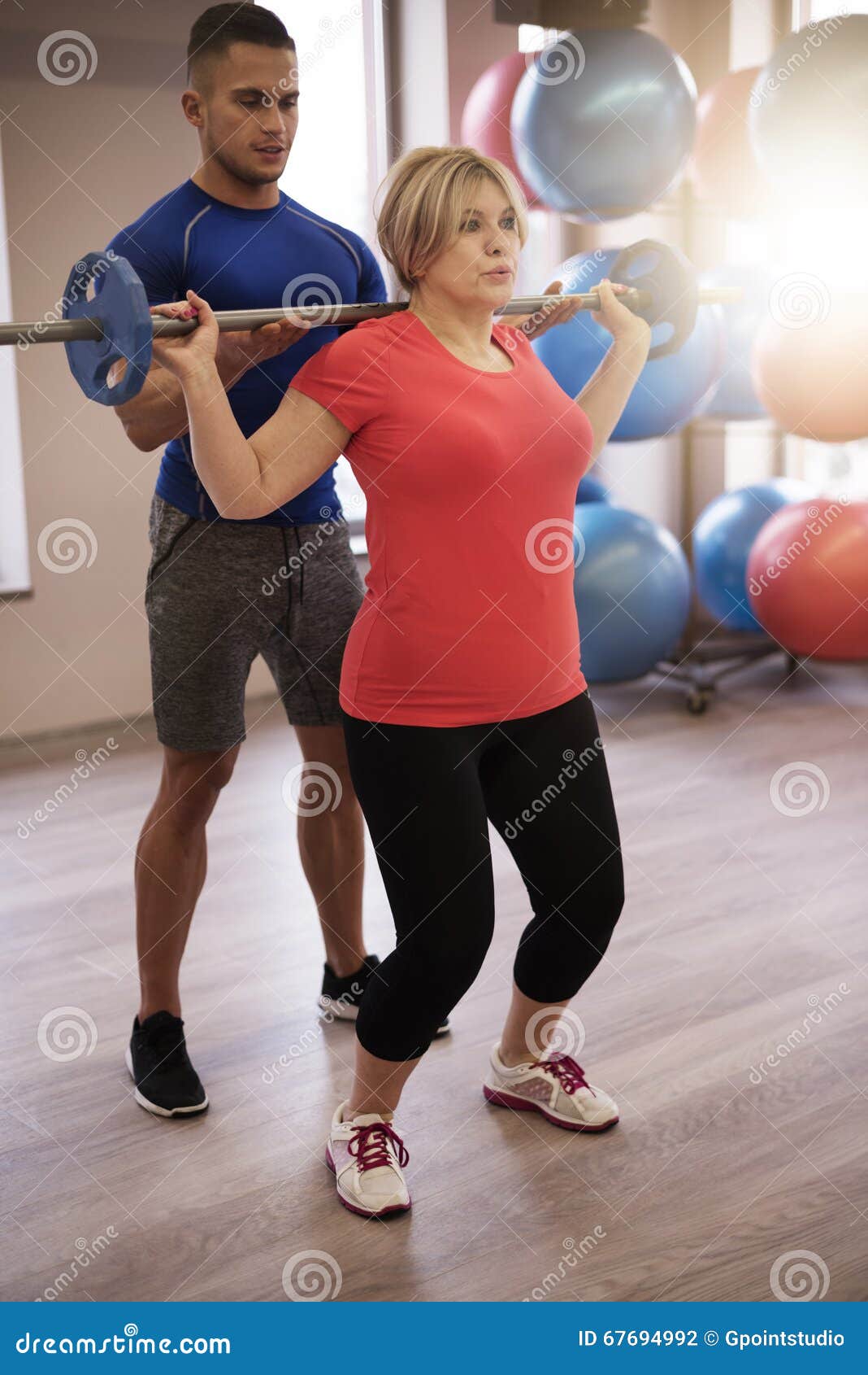 Working out with trainer stock photo. Image of action - 67694992