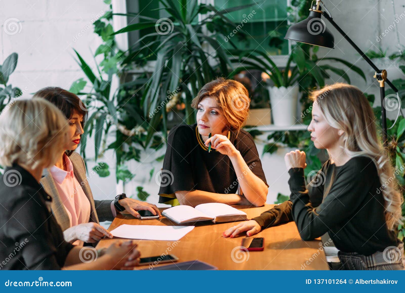 Working Overtime Concept. Group of Female Business Team Working Late at ... Working Overtime Concept. Group of Female Business Team Working Late at ...