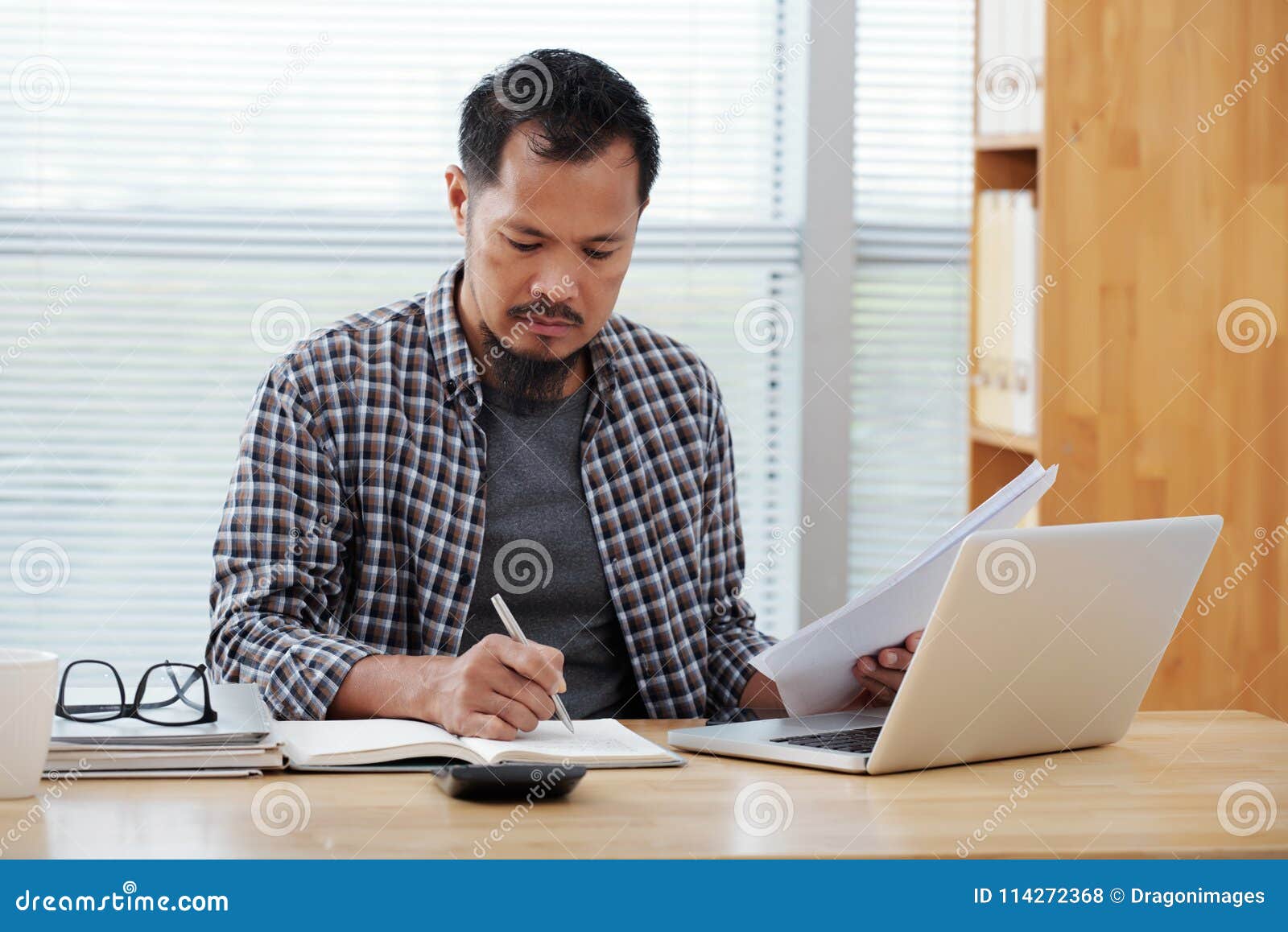 Working with papers stock photo. Image of planning, checking - 114272368