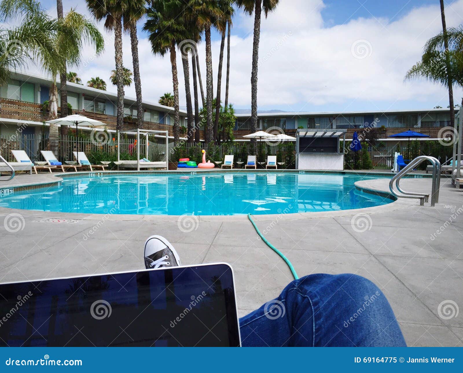 Working by the Pool stock image. Image of hotel, holidays - 69164775