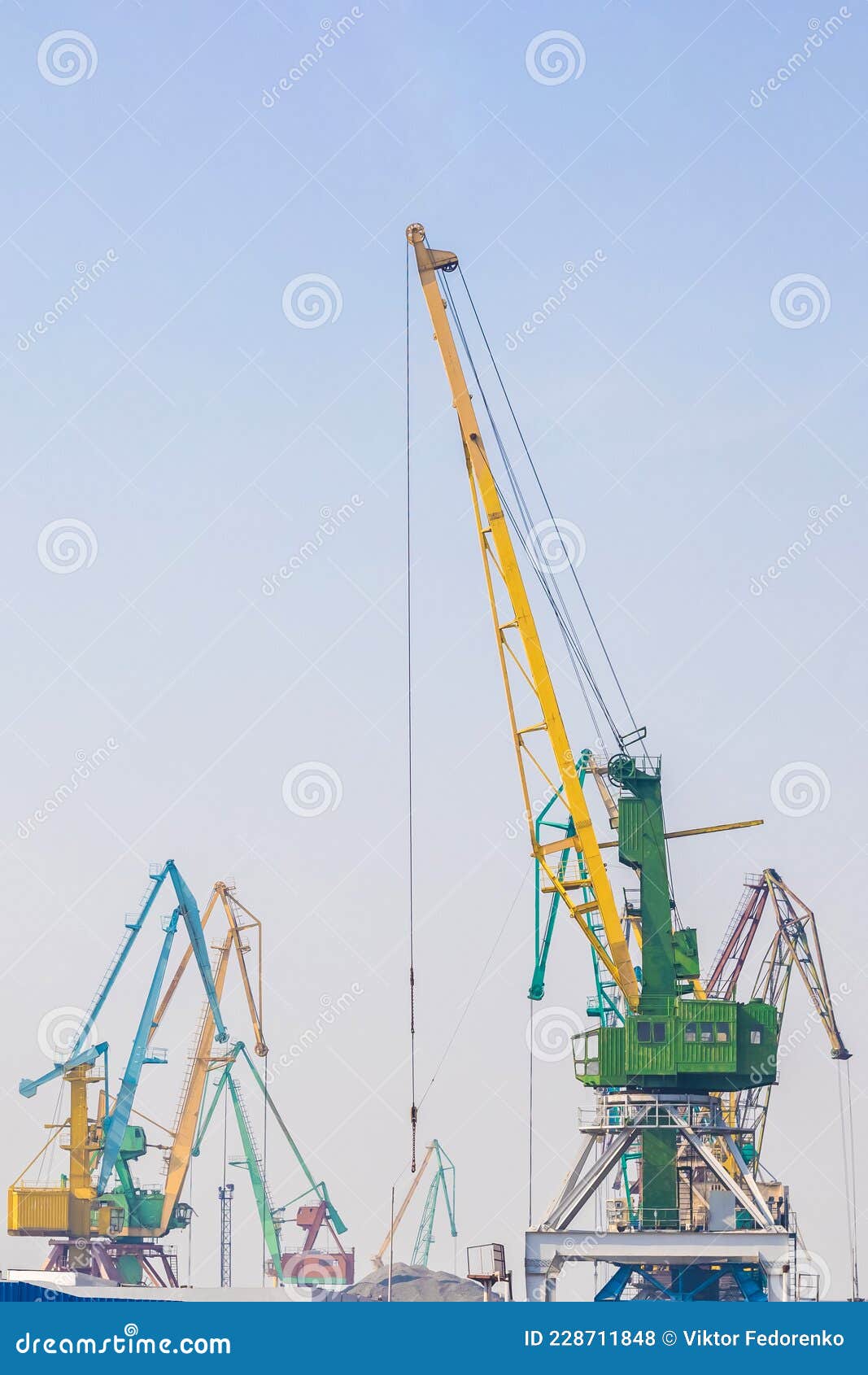 Working Port Cranes. Unloading and Loading of Goods at the Port Stock ...
