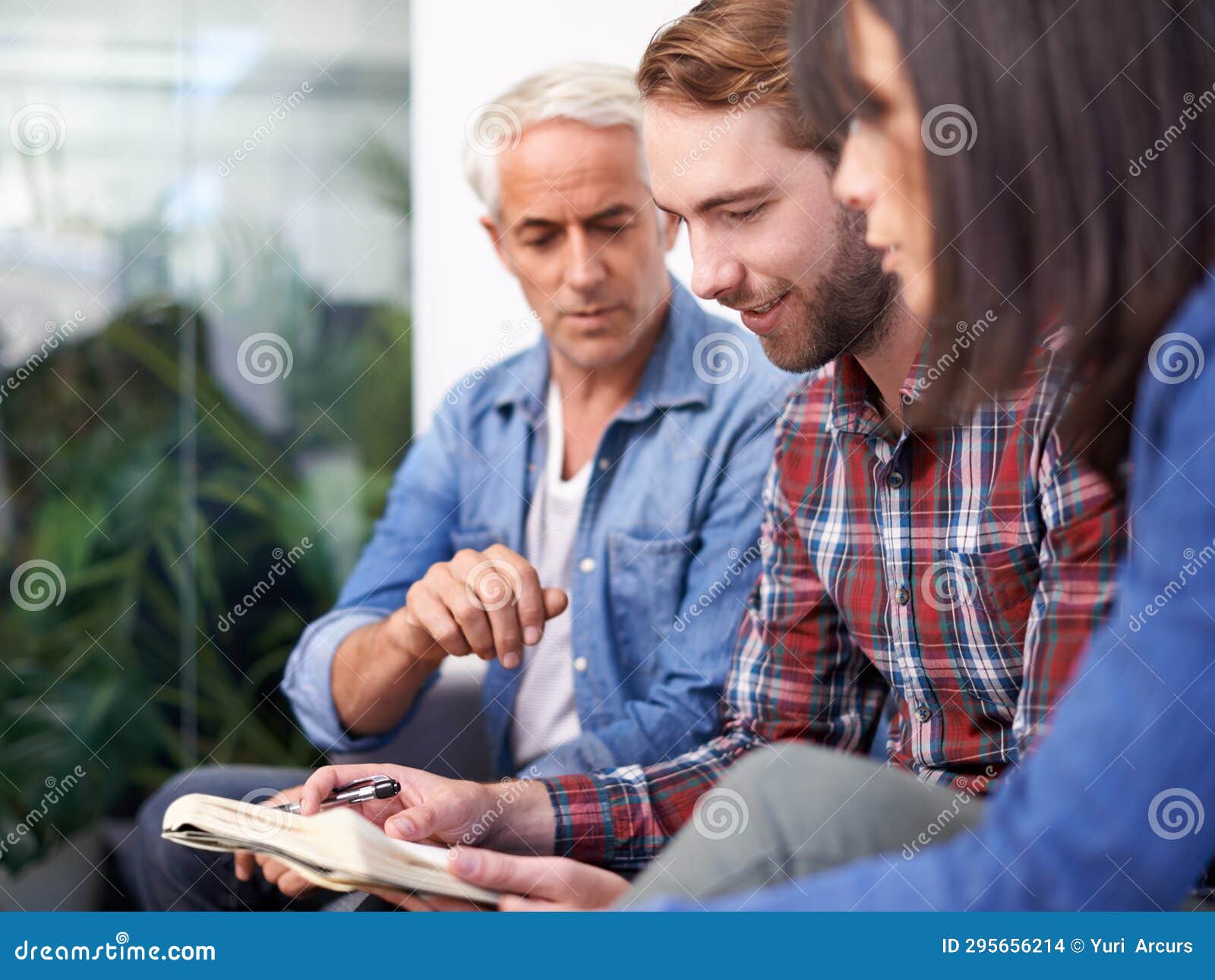 Working through the Possibilities. a Group of Coworkers in a Meeting ...