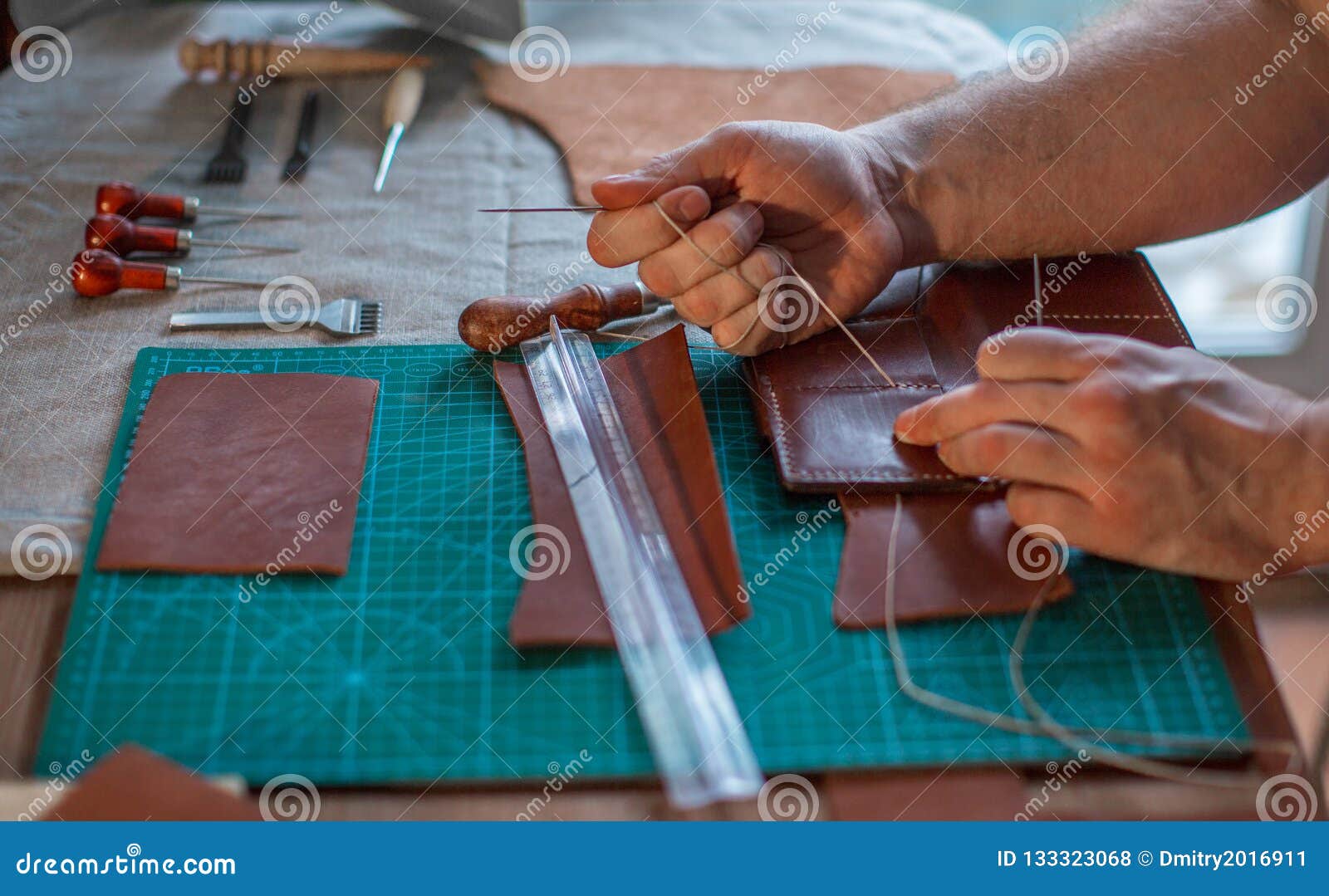 Working Process of the Leather Belt in the Leather Workshop. Man ...