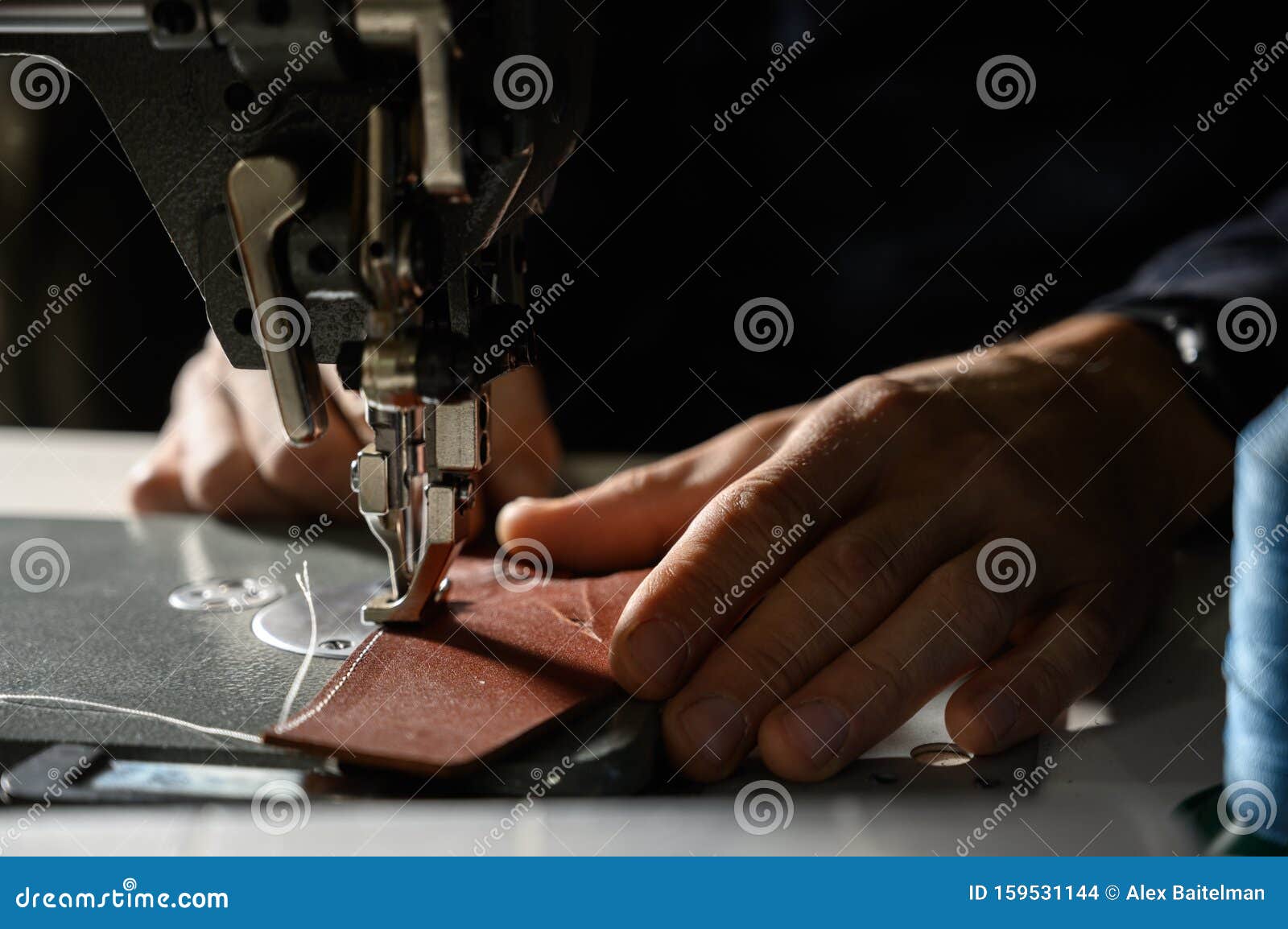 Working Process of Leather Craftsman. Tanner or Skinner Sews Leather on ...