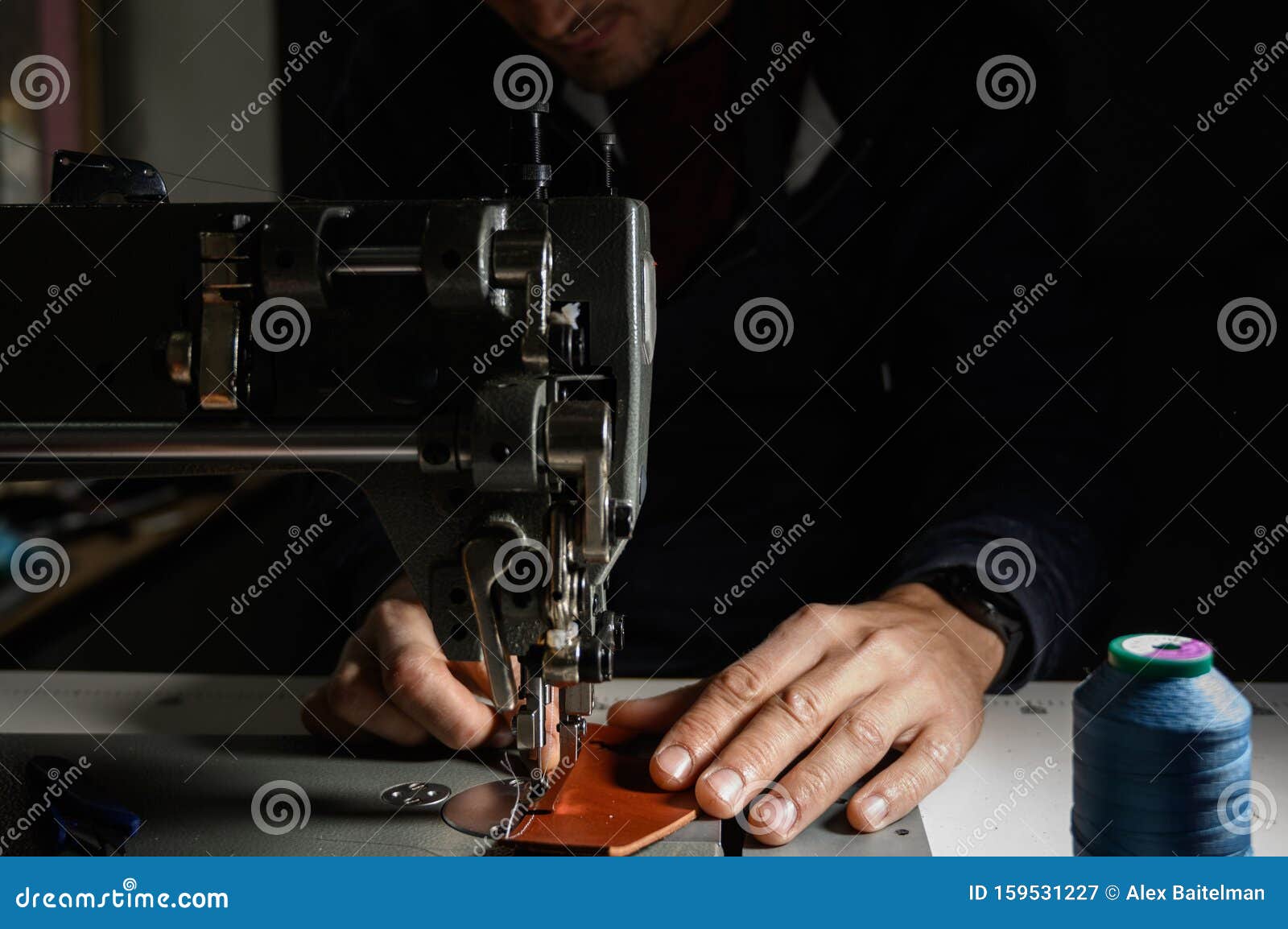 Working Process of Leather Craftsman. Tanner or Skinner Sews Leather on ...