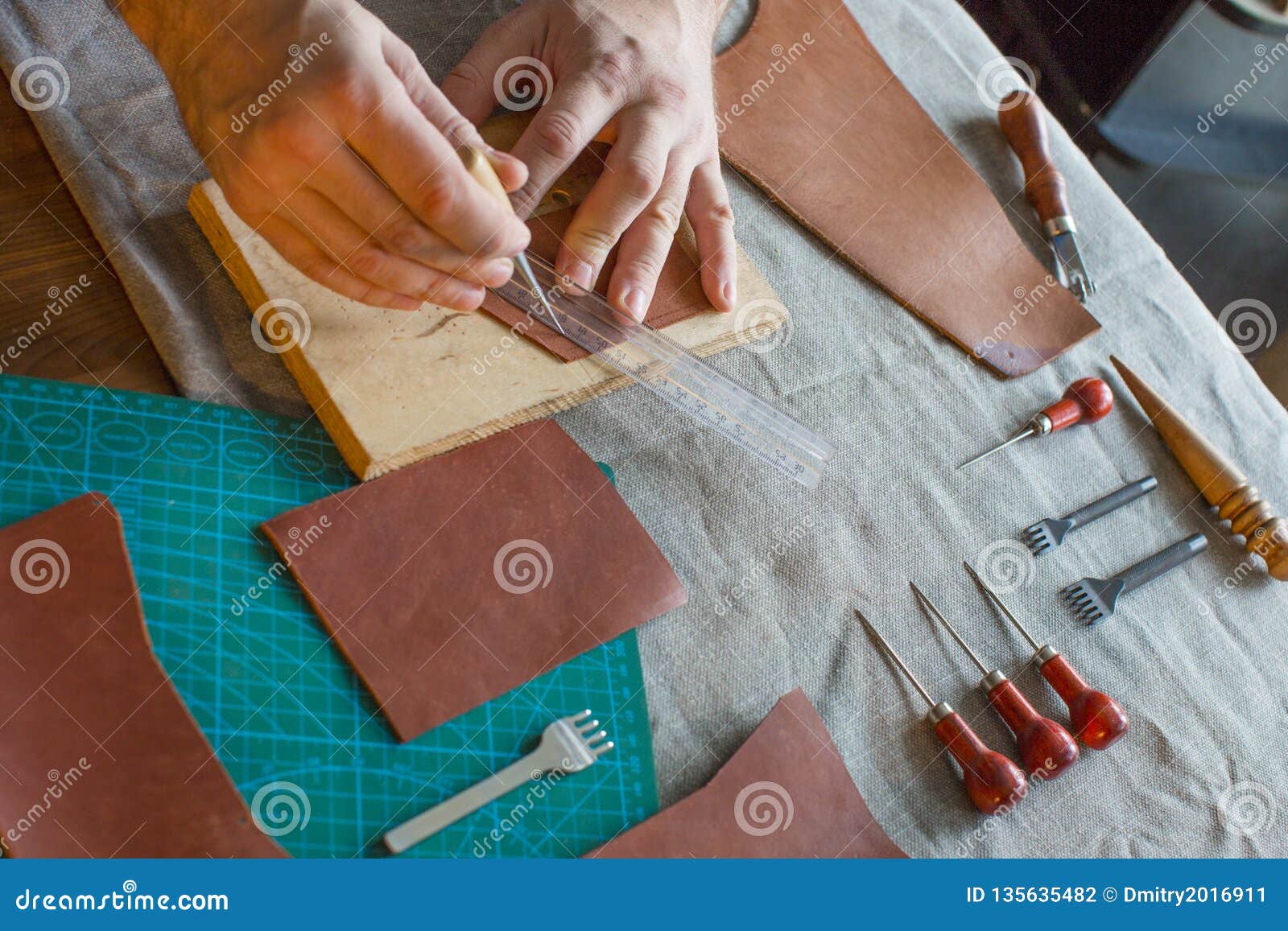 Working Process in the Leather Workshop. Man Holding Crafting Tool and ...