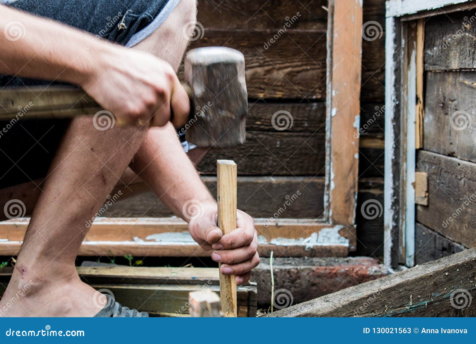 Working Process. Men`s Hands at Work. Clogging the Boards. Tools - a ...