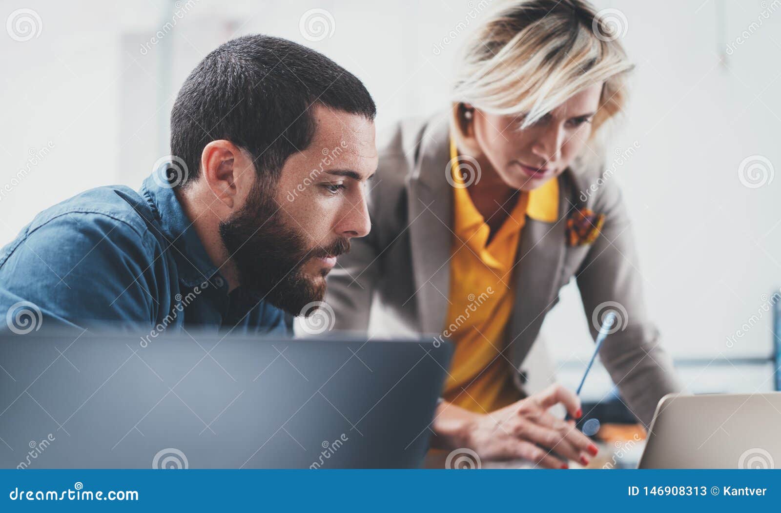 Working Process Moments.Two Young Coworkers Working Together at Modern ...