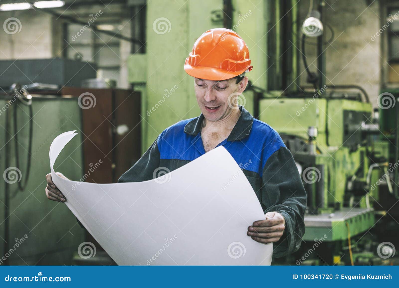 Working in Production Against a Background of Machines from the Stock ...