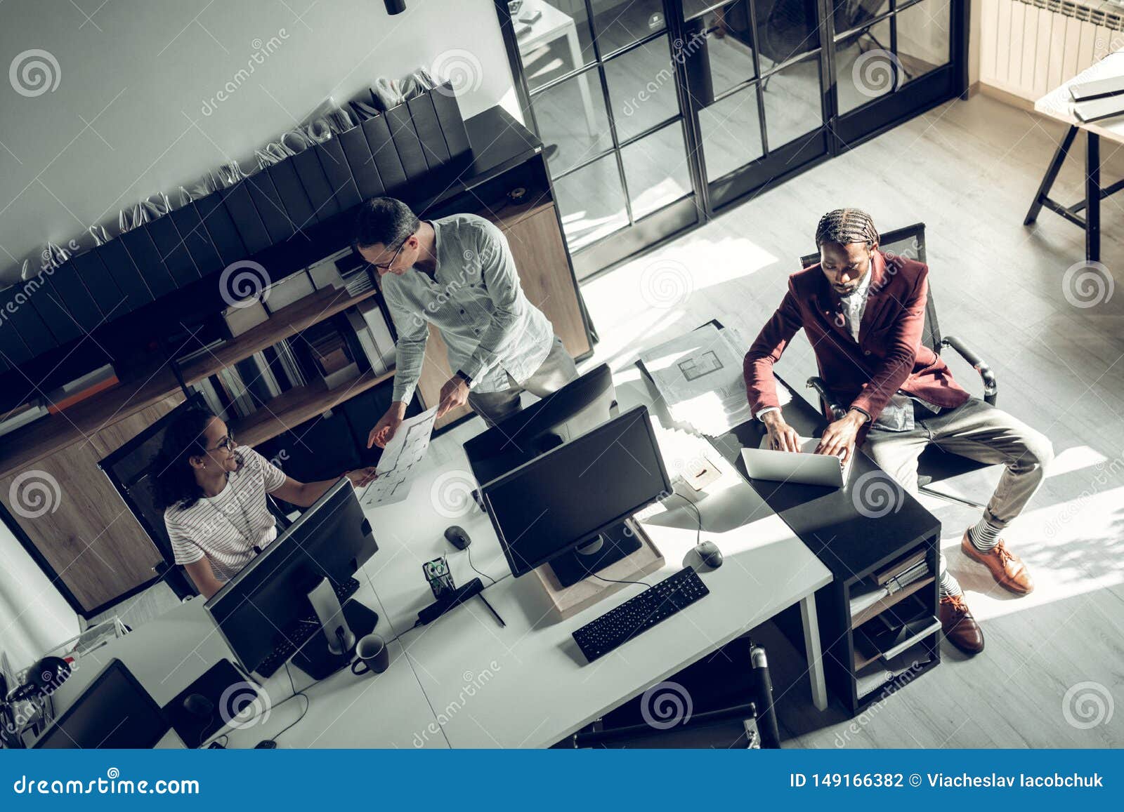 Three Successful Businessmen Working on Project Together Stock Photo ...