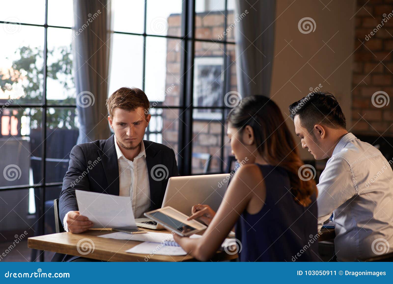 Working on report together stock image. Image of document - 103050911