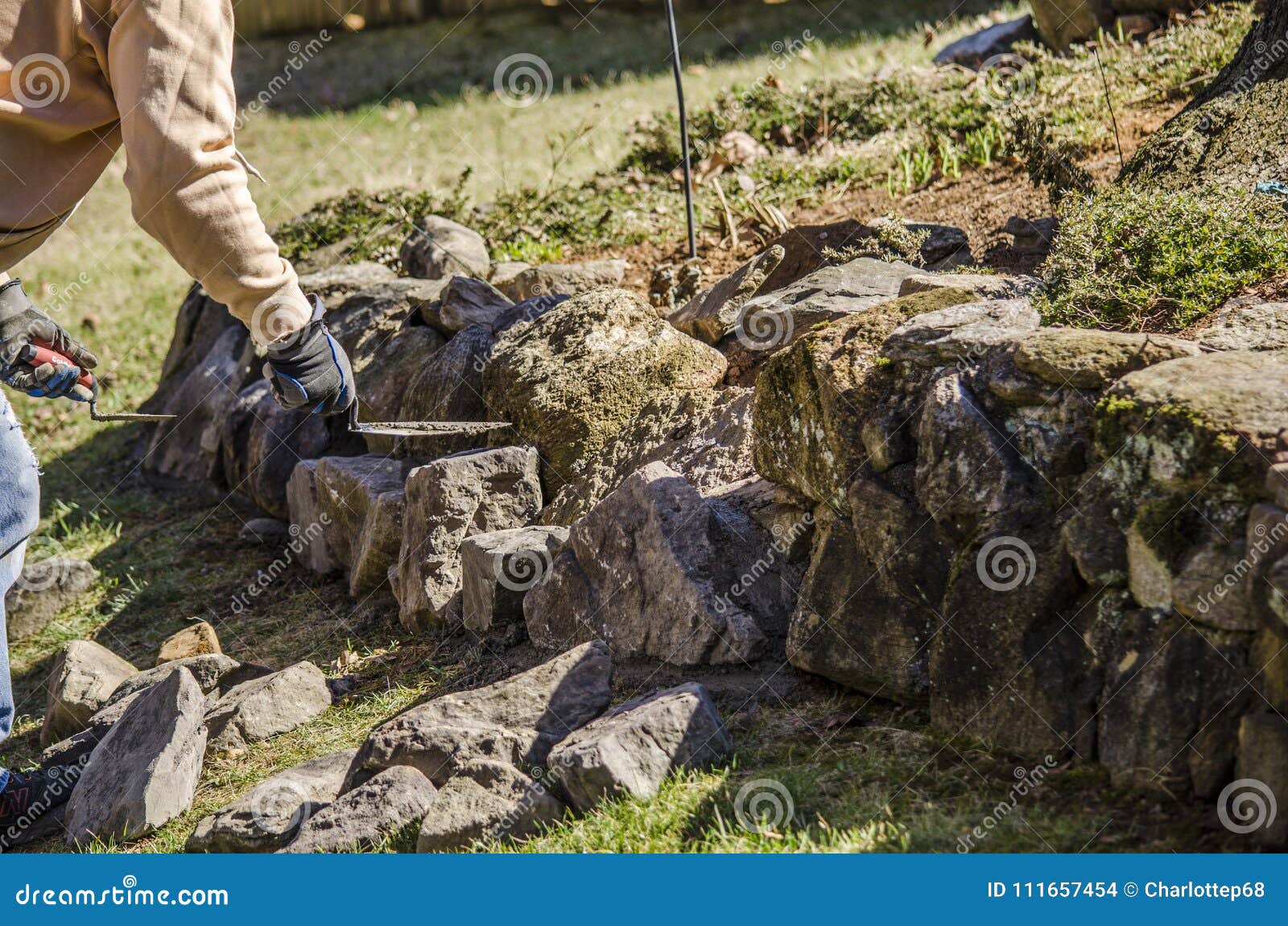 Working on a rock wall stock photo. Image of self, making - 111657454