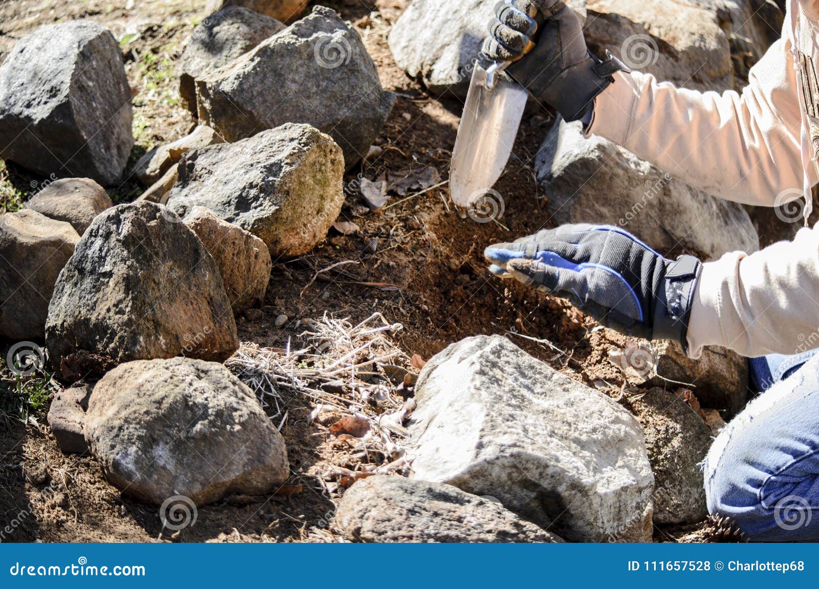 Working on a rock wall stock photo. Image of mortar - 111657528