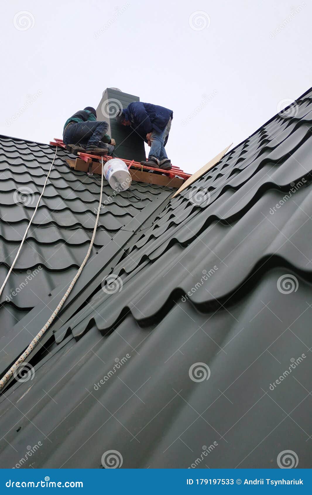 Working with Roofing Material, Metal Roof, Hand Tools Screwdriver Stock ...