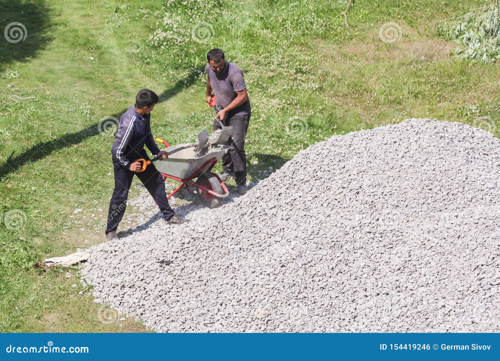 Working with Shovels Loaded Rubble Editorial Photo - Image of worker ...