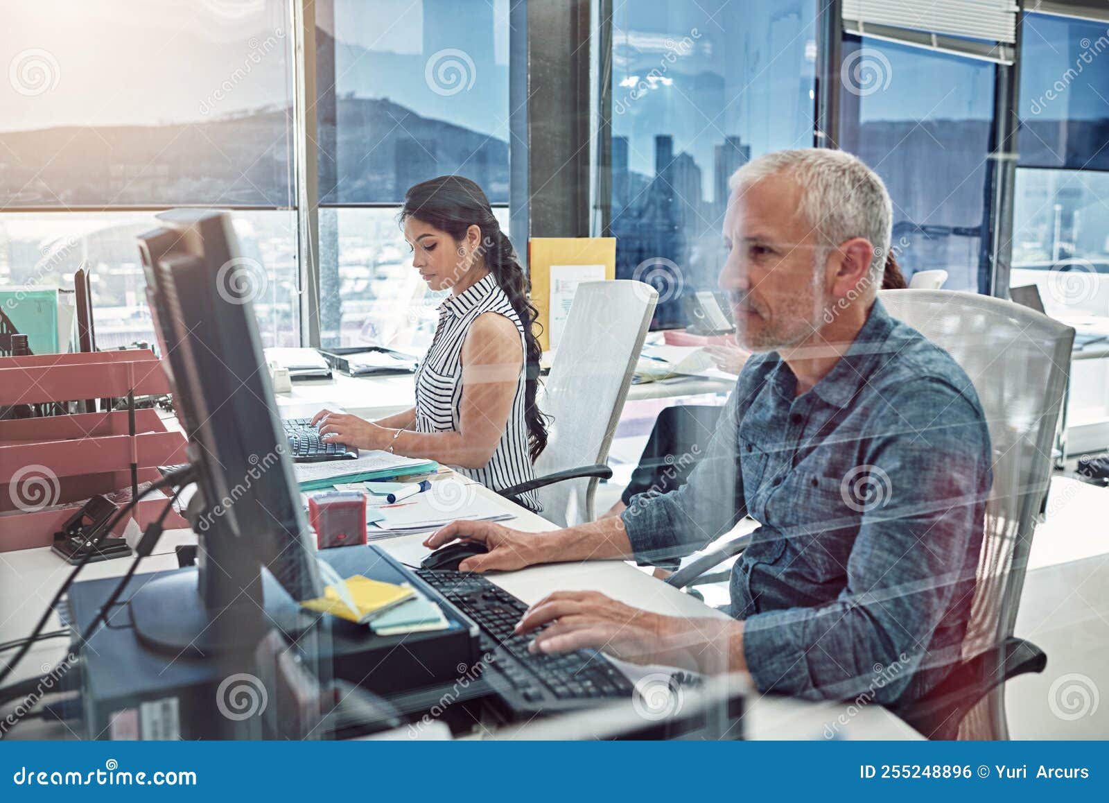 Working Side by Side. Two Colleagues Working in the Office. Stock Photo ...