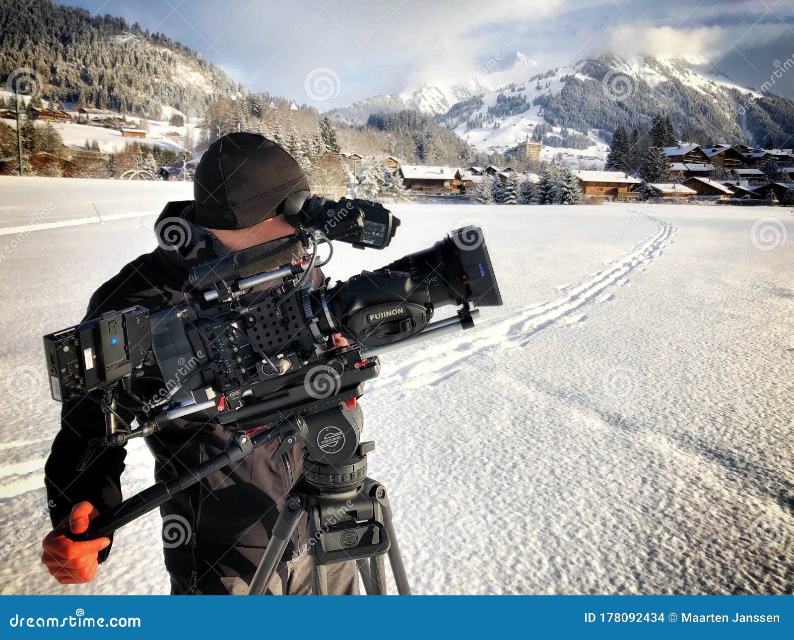 Working in the snow editorial stock image. Image of cameraman - 178092434