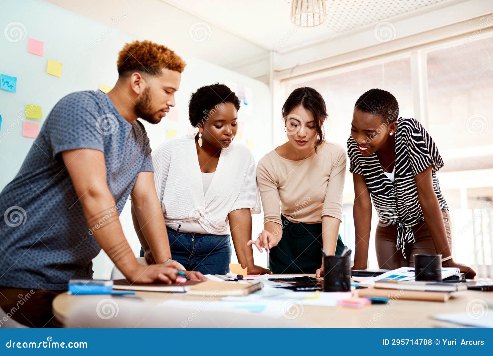 Working on Something New and Different for Their Customers. a Group of ...