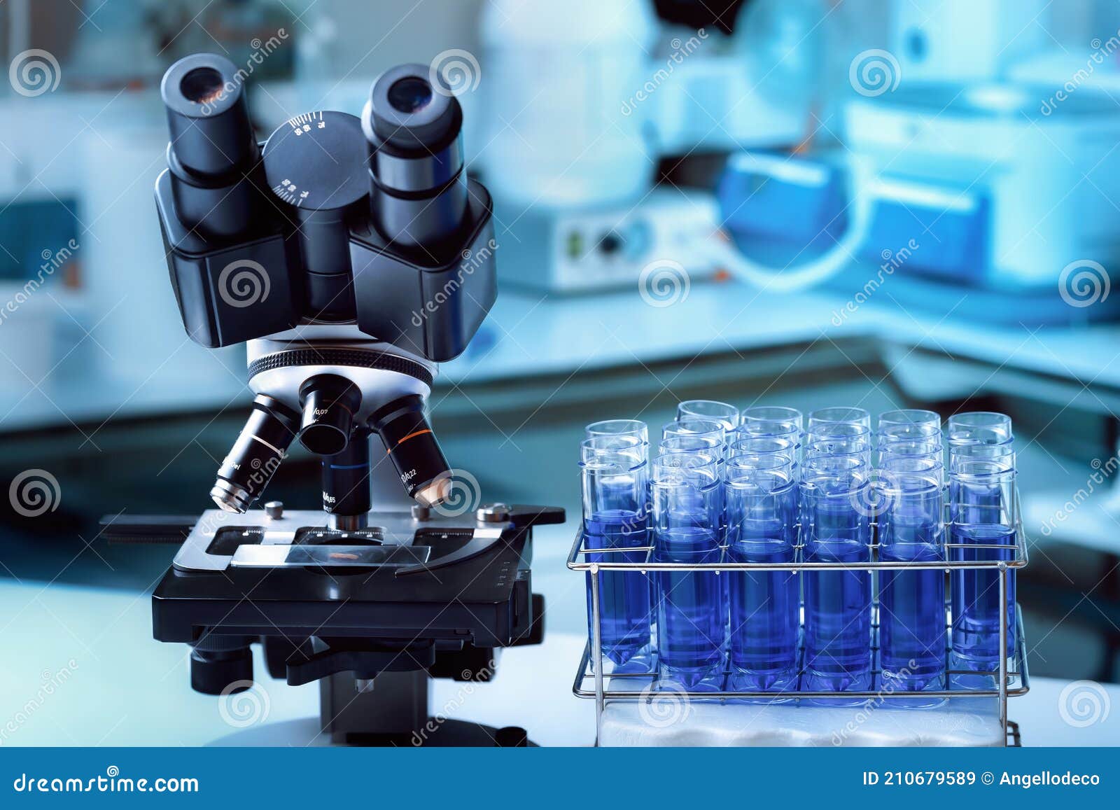 Microscope and Rack with Sample Tubes in the Microbiology Laboratory ...