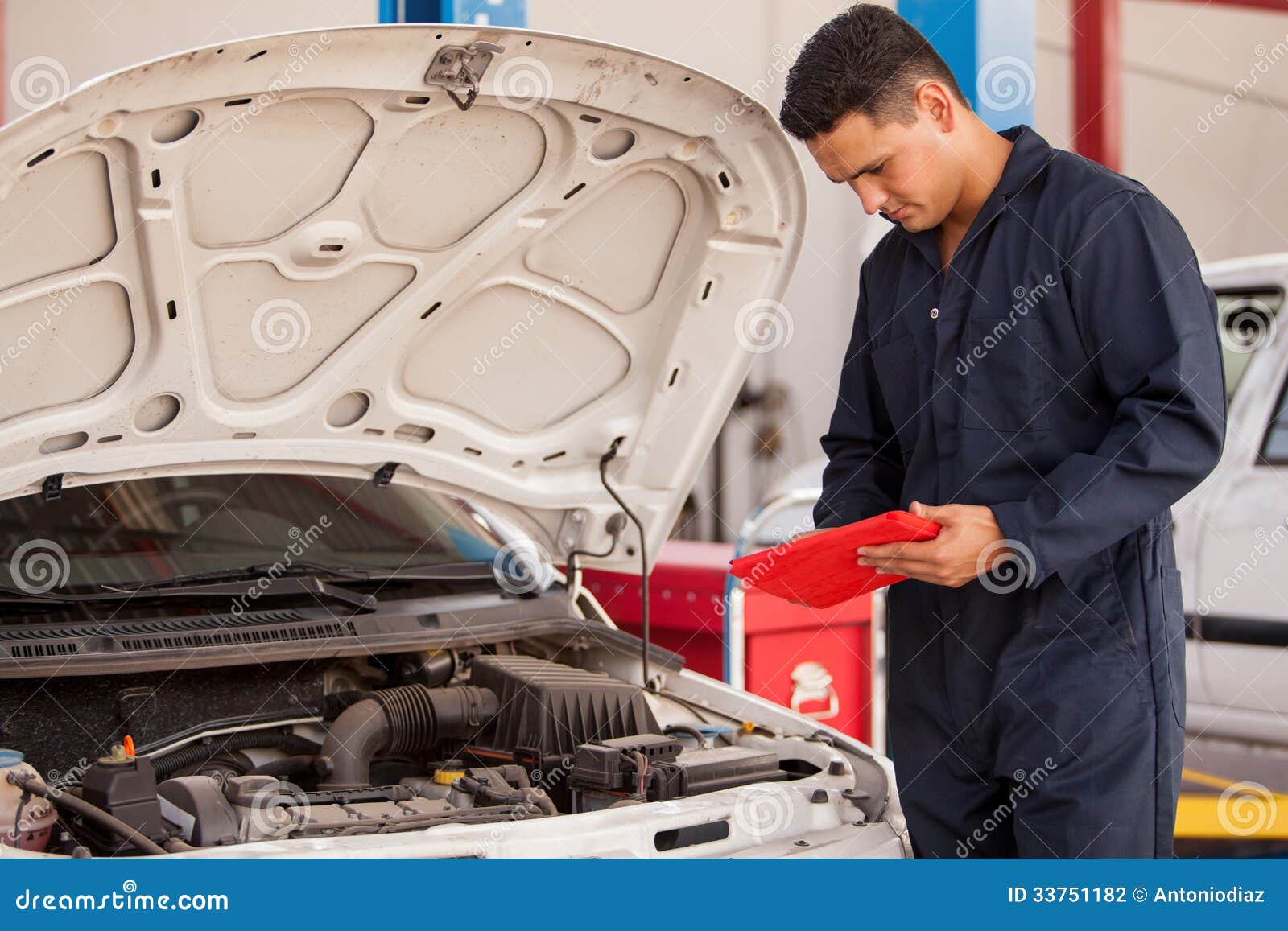 Working with a Tablet Computer Stock Photo - Image of hispanic, hood ...