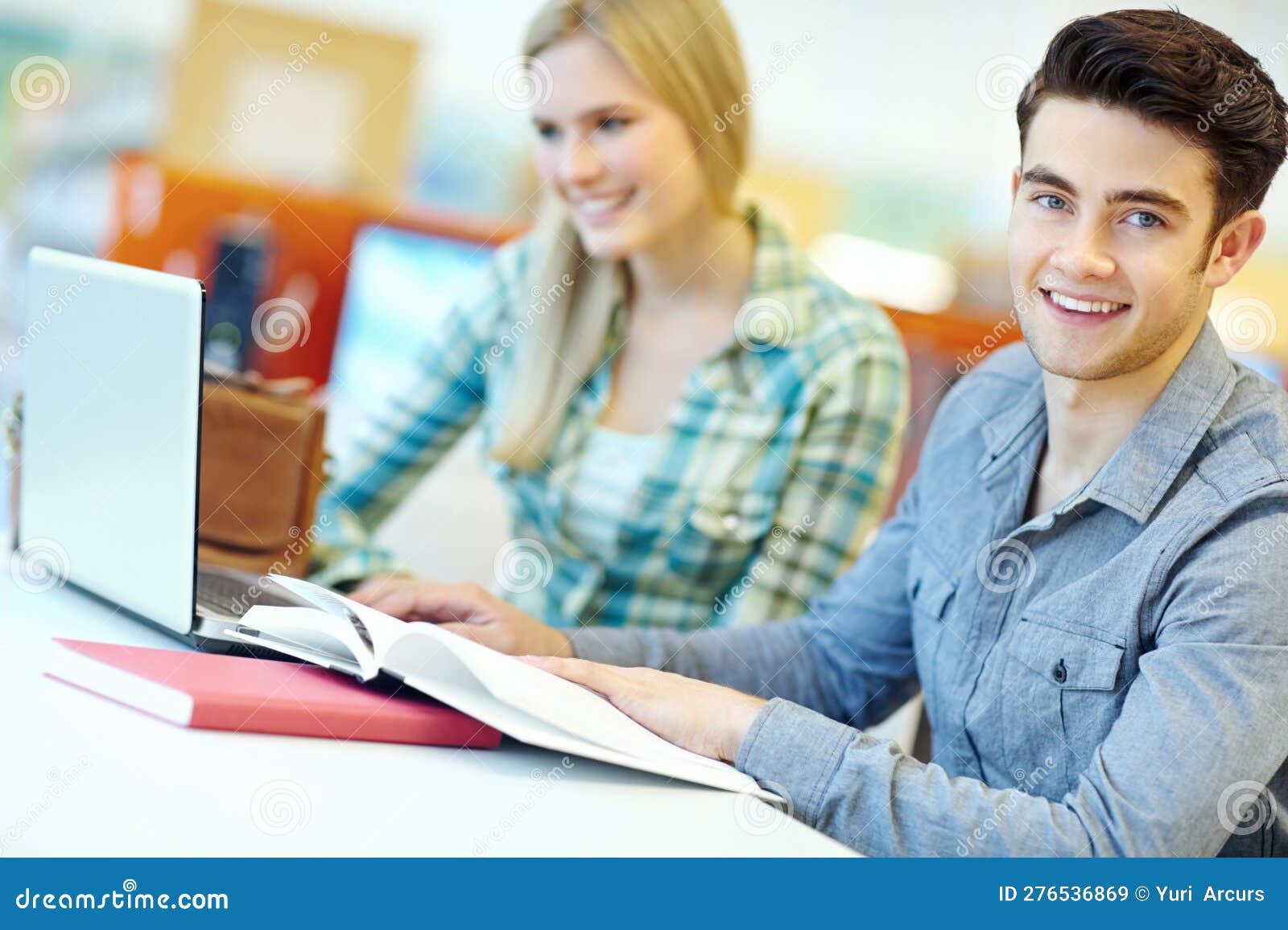 Working from the Textbook. Two Smiling Students Helping Each Other with ...