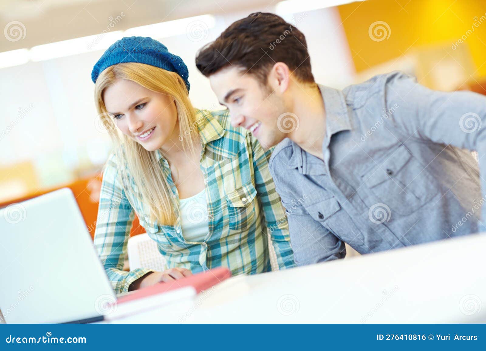 Working Together on a Class Project. Two Smiling Students Helping Each ...