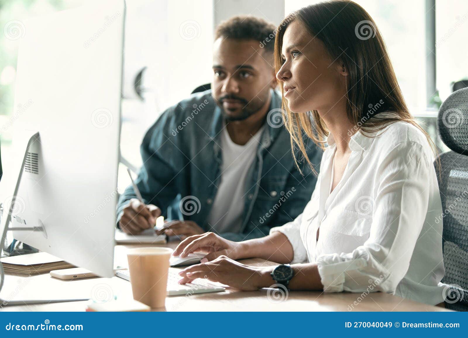 Working Together on Project. Two Business Colleagues Working on ...