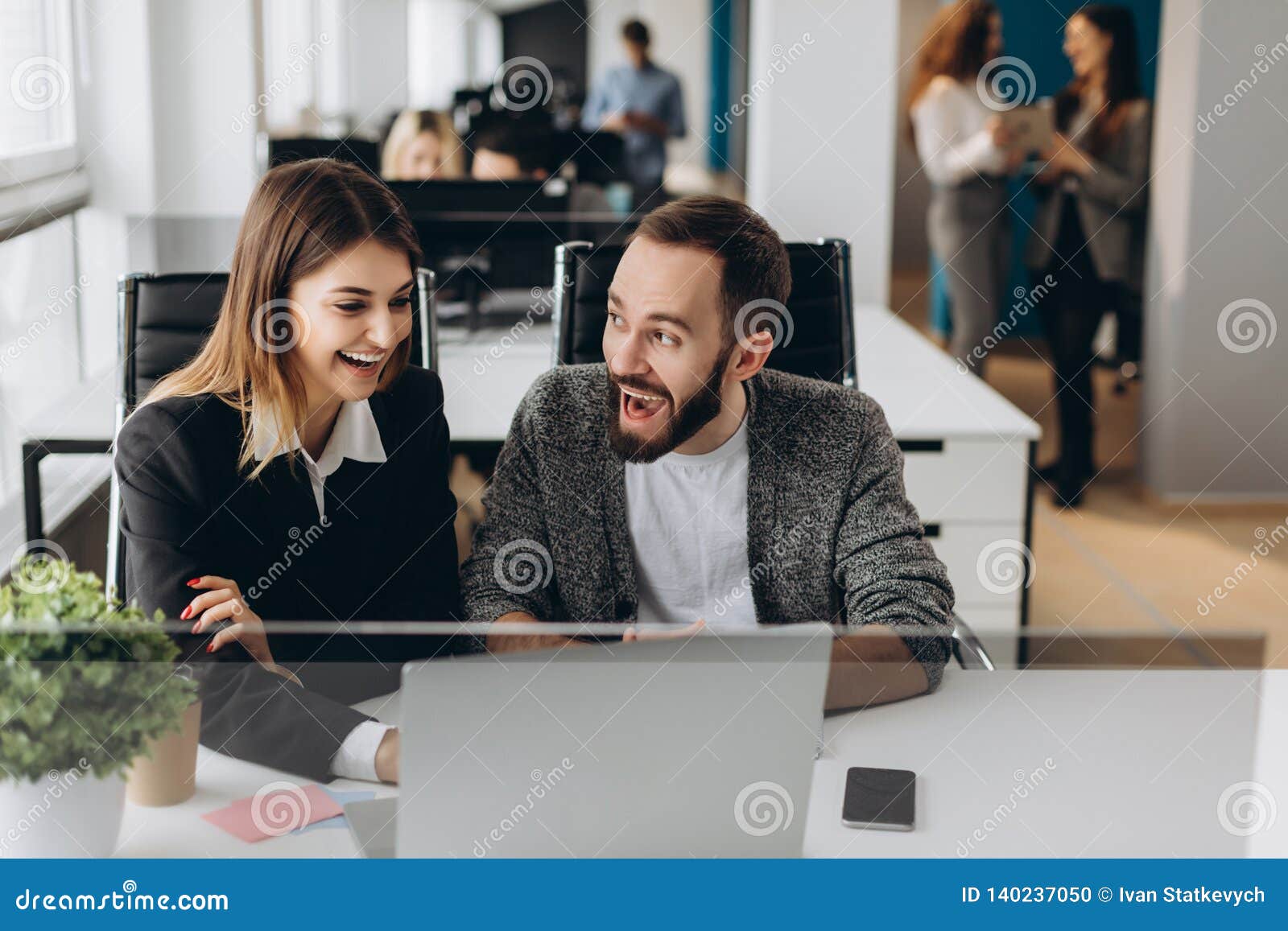 Working Together on Project. Two Young Business Colleagues Working on ...