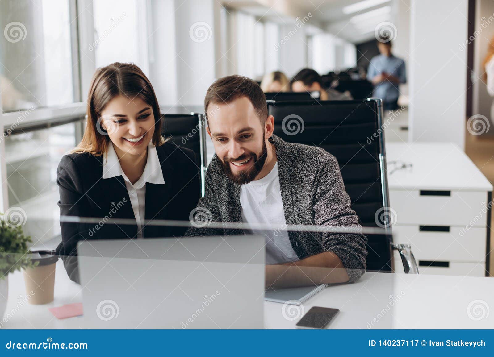 Working Together on Project. Two Young Business Colleagues Working on ...