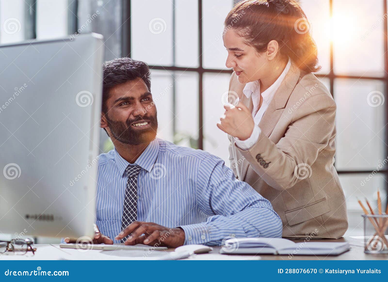 Working Together on Project. Two Young Business Colleagues Working on ...