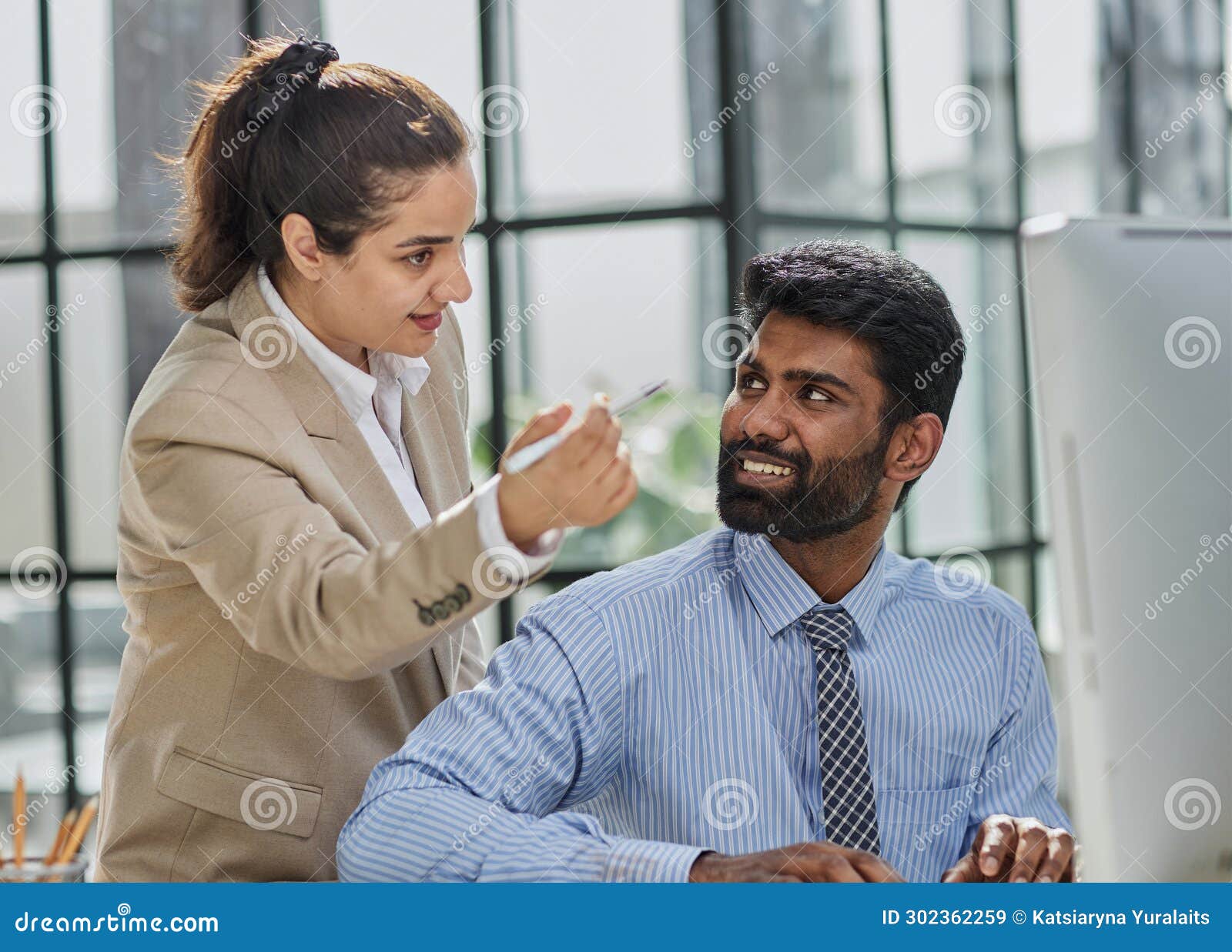 Working Together on Project. Two Young Business Colleagues Working on ...