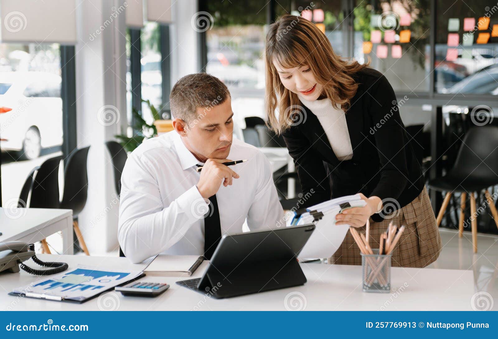 Working Together on a Project Two Young Business Colleagues Working on ...